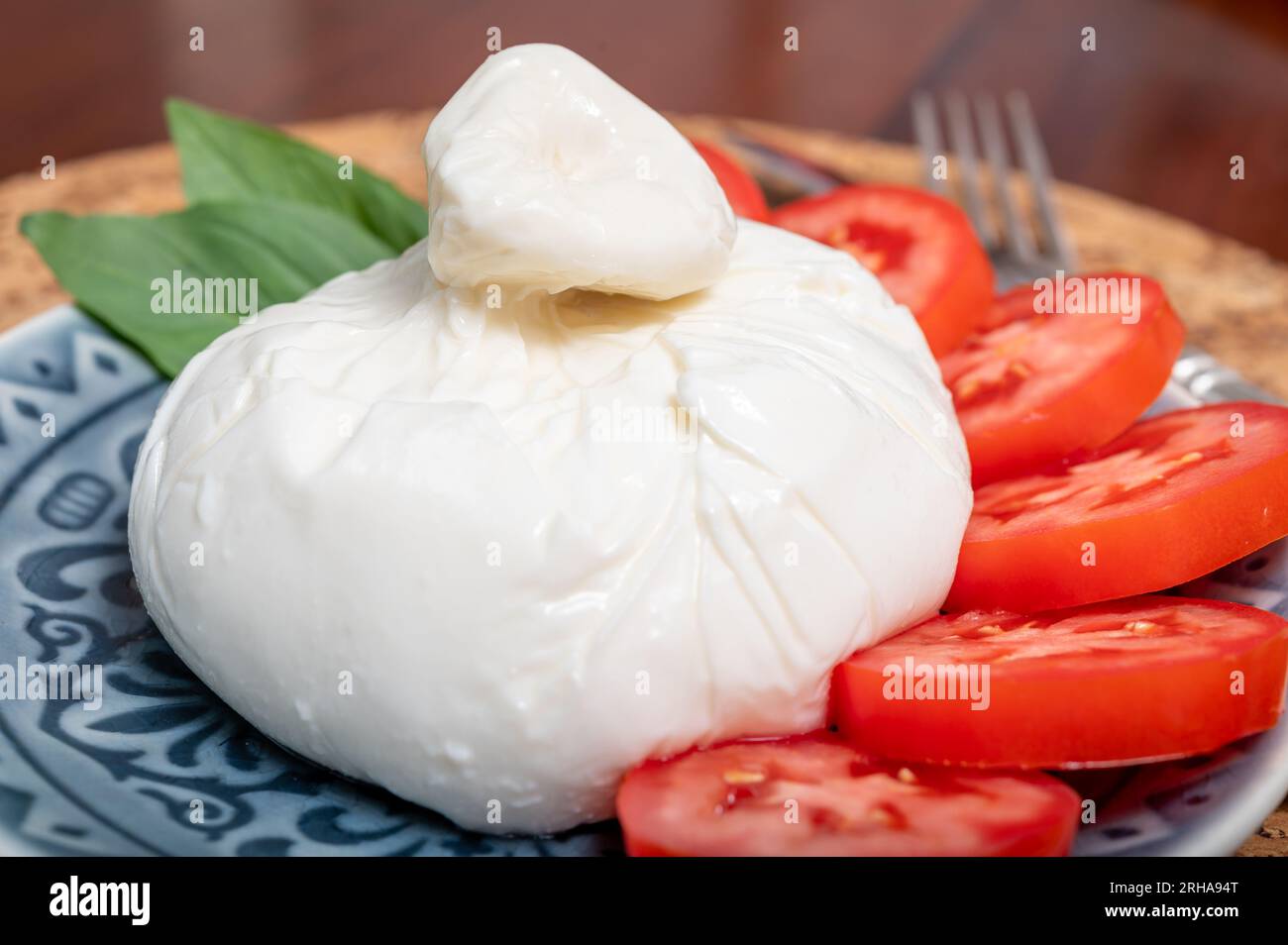Fresh handmade soft Italian cheese from Puglia, white ball of burrata ...