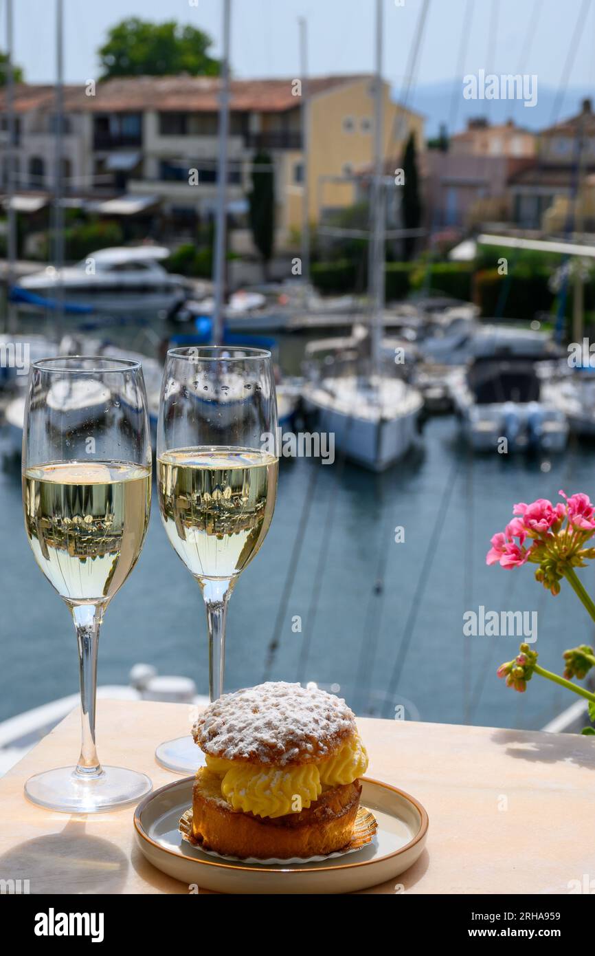 Drinking of French brut champagne sparkling wine with cake Tarte ...