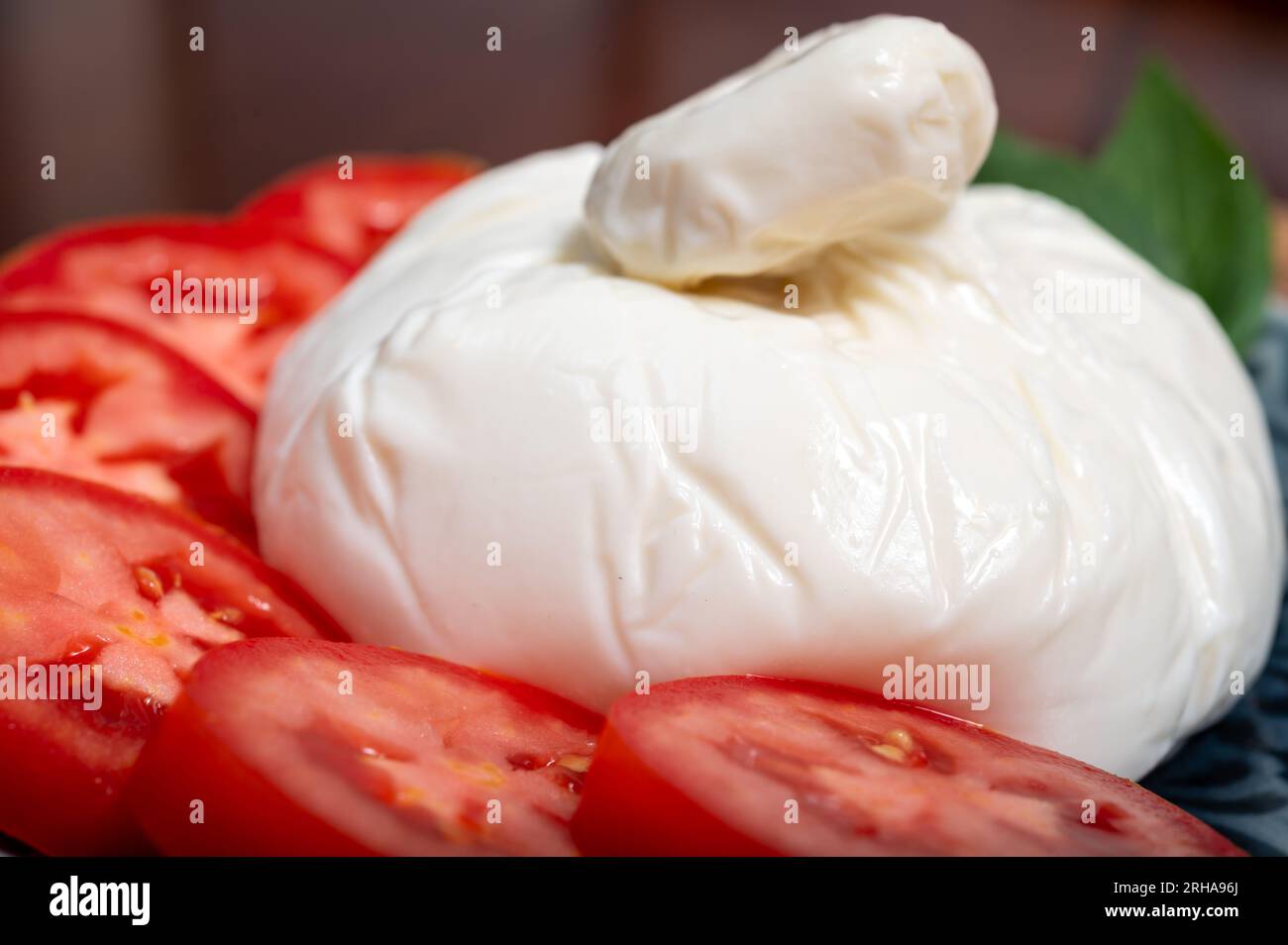 Fresh handmade soft Italian cheese from Puglia, white ball of burrata ...