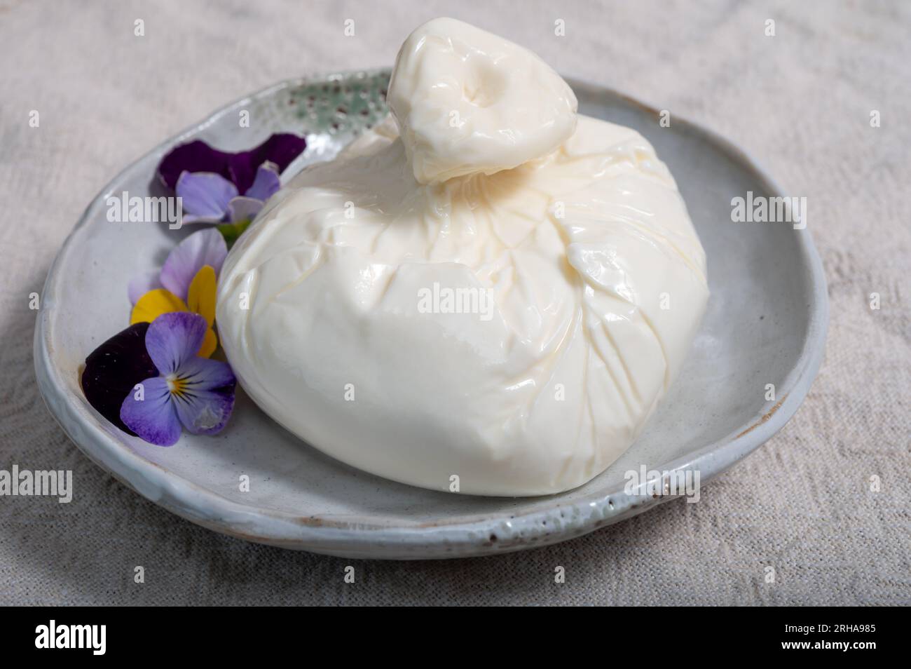 Fresh handmade soft Italian cheese from Puglia, white ball of burrata ...