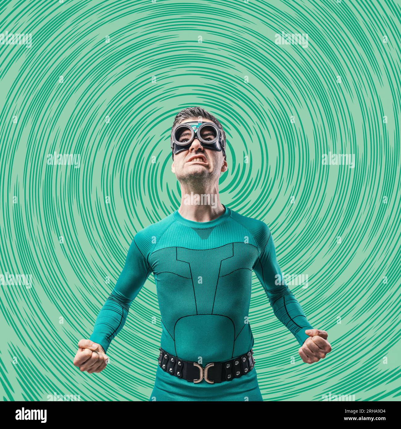 Funny green superhero snarling and ready to punch Stock Photo - Alamy