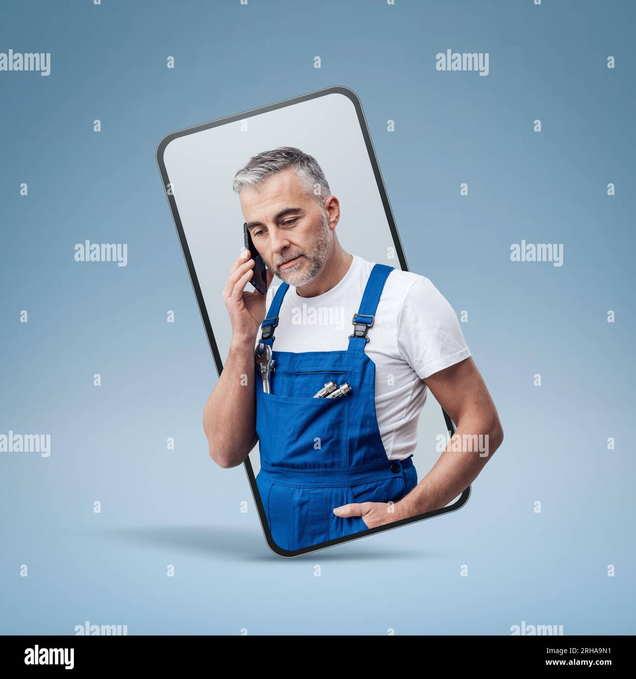 Confident repairman and plumber having a phone call in a smartphone ...