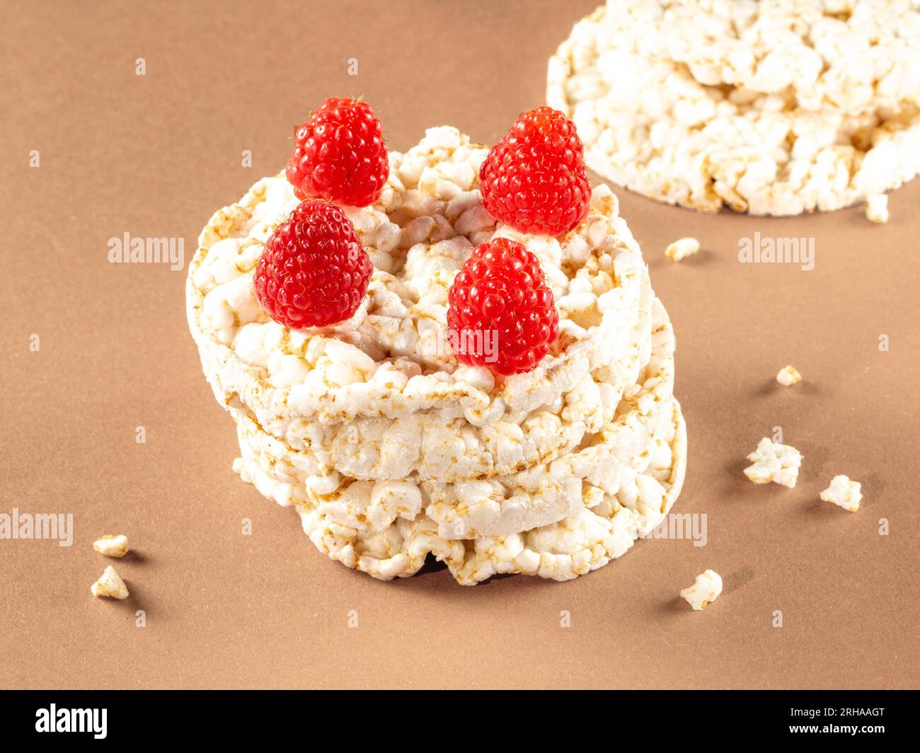 Stack of rice cakes with raspberries on top Stock Photo - Alamy