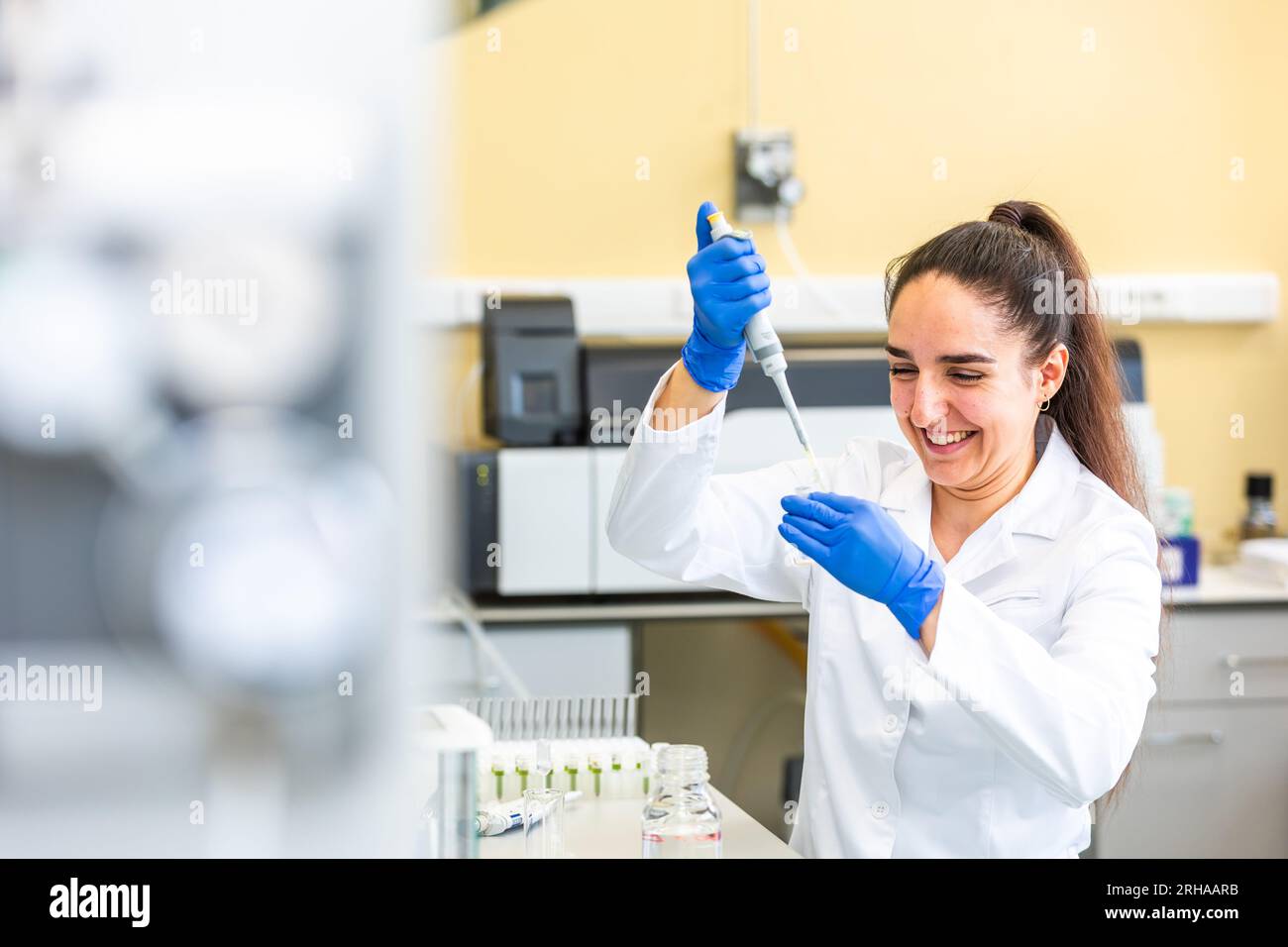 Young woman scientist in a research laboratory creating a scientific experiment, laboratory ...