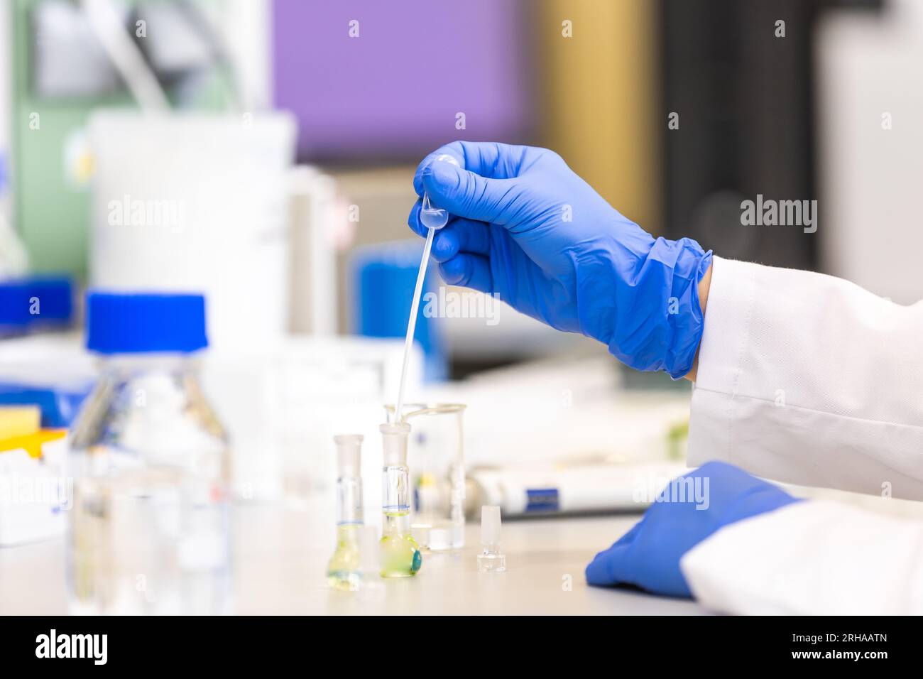 Young woman scientist in a research laboratory creating a scientific ...
