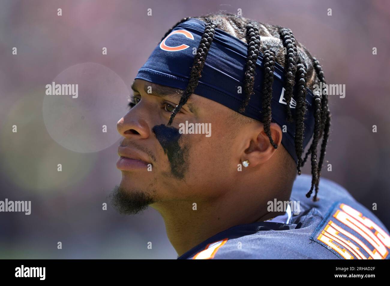 Chicago Bears quarterback Justin Fields looks at the scoreboard in an ...