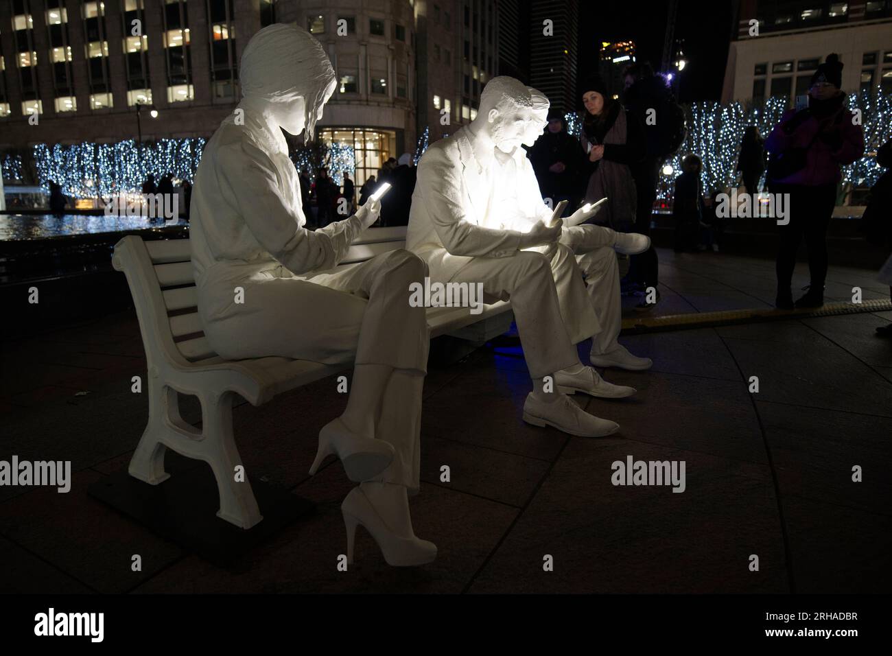 Statues of people showing mobile phone addiction - Canary Wharf Winter ...