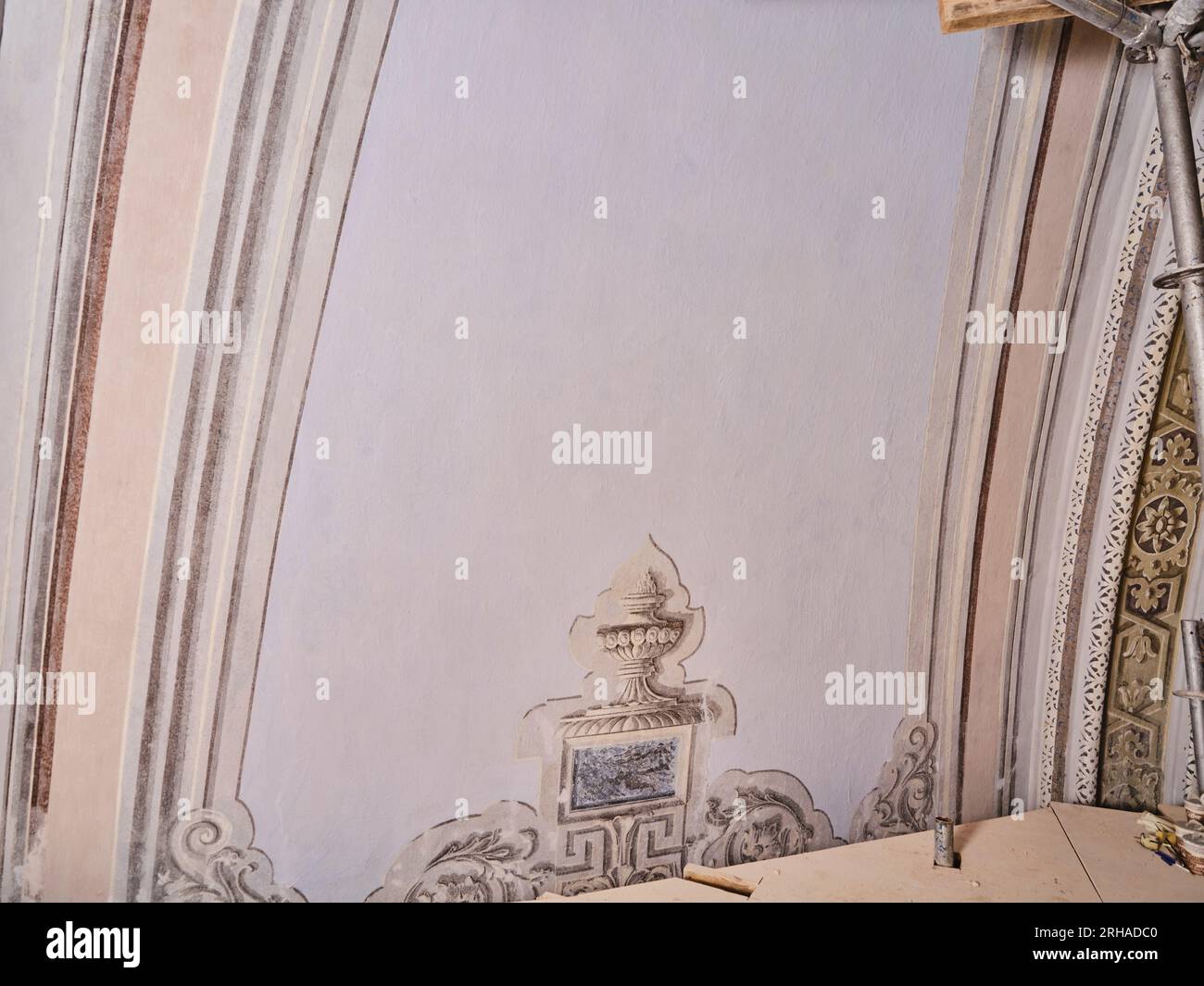 female artist doing old painting restoration. wall painting historical ...