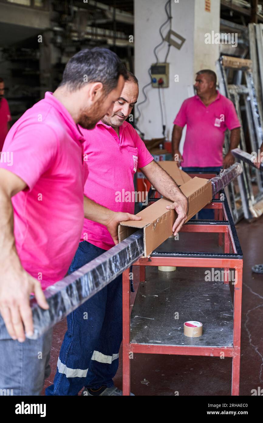 Workers packing cardboard box in warehouse for shipment. an operator ...