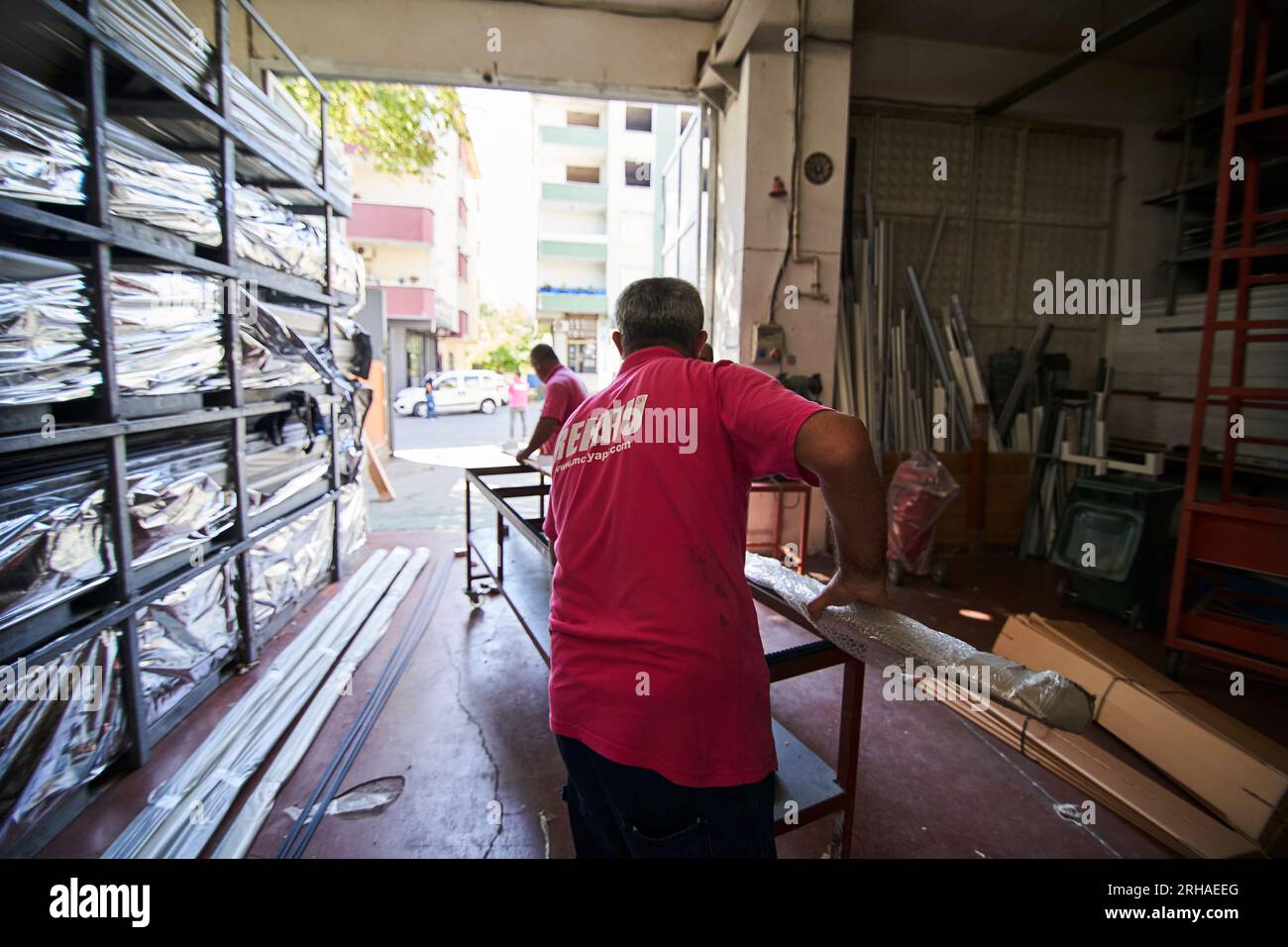 Workers packing cardboard box in warehouse for shipment. an operator ...