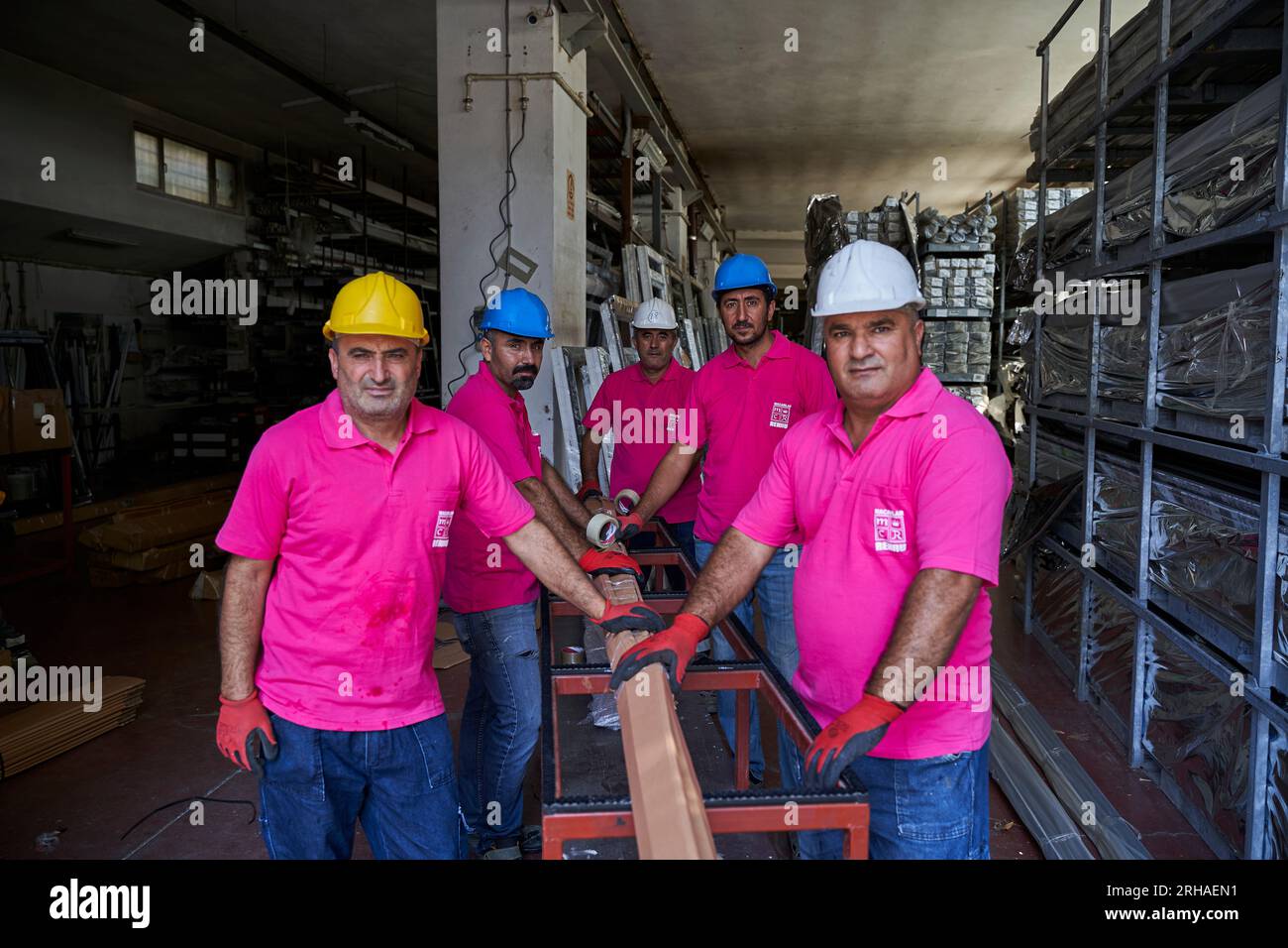 Workers packing cardboard box in warehouse for shipment. an operator ...