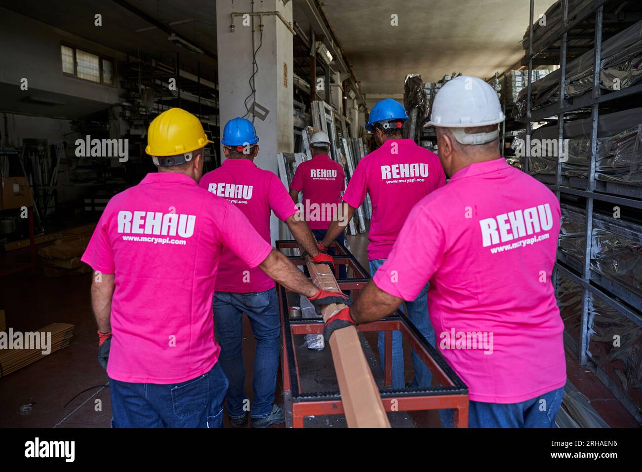 Workers packing cardboard box in warehouse for shipment. an operator ...