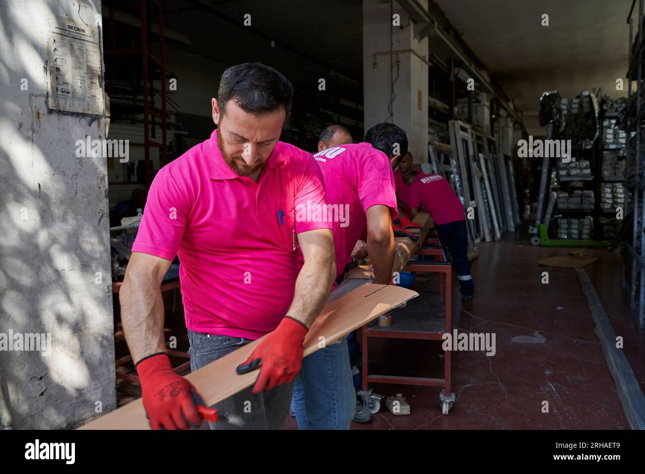 Workers packing cardboard box in warehouse for shipment. an operator ...