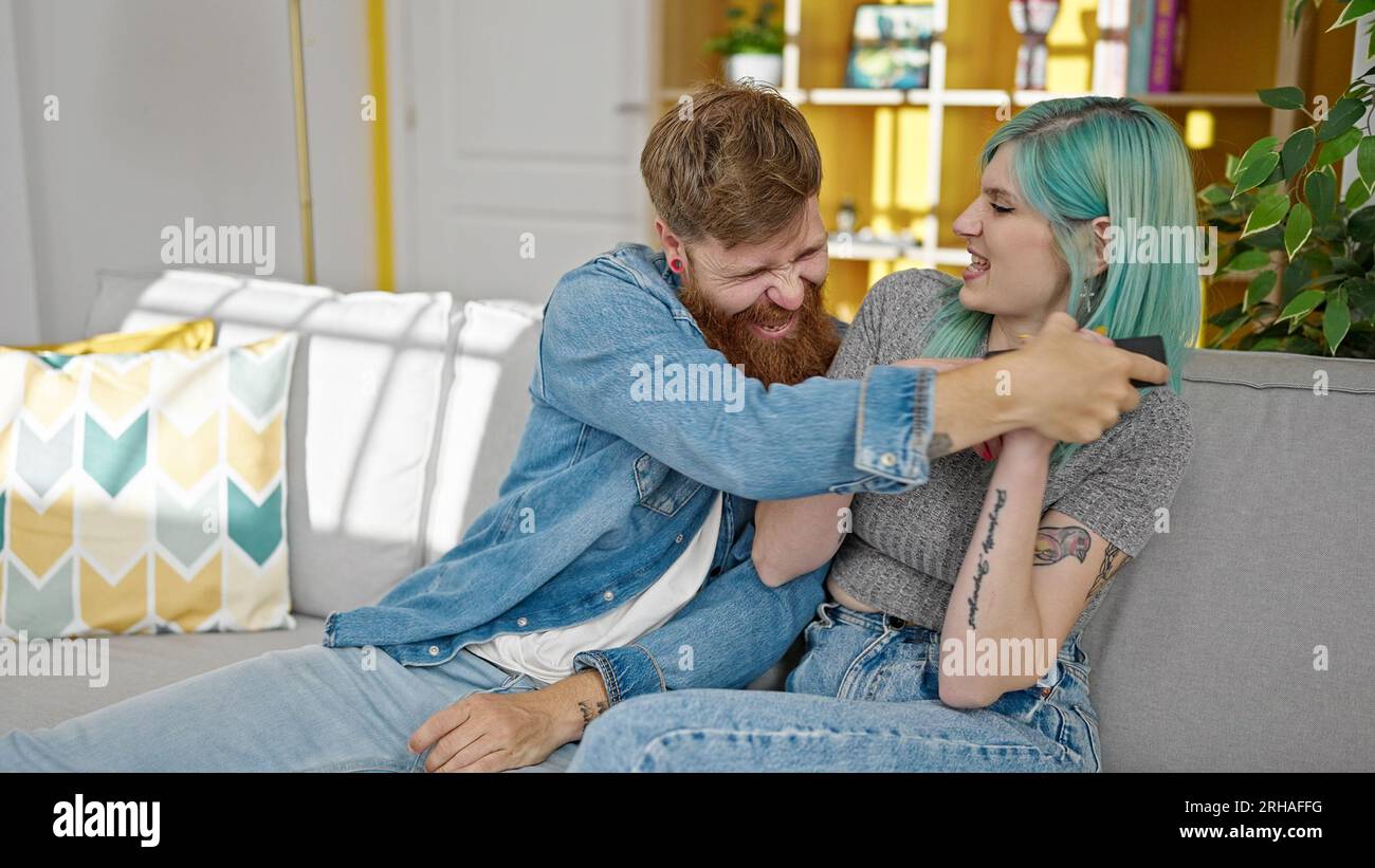 Fighting for the tv remote hi-res stock photography and images - Alamy