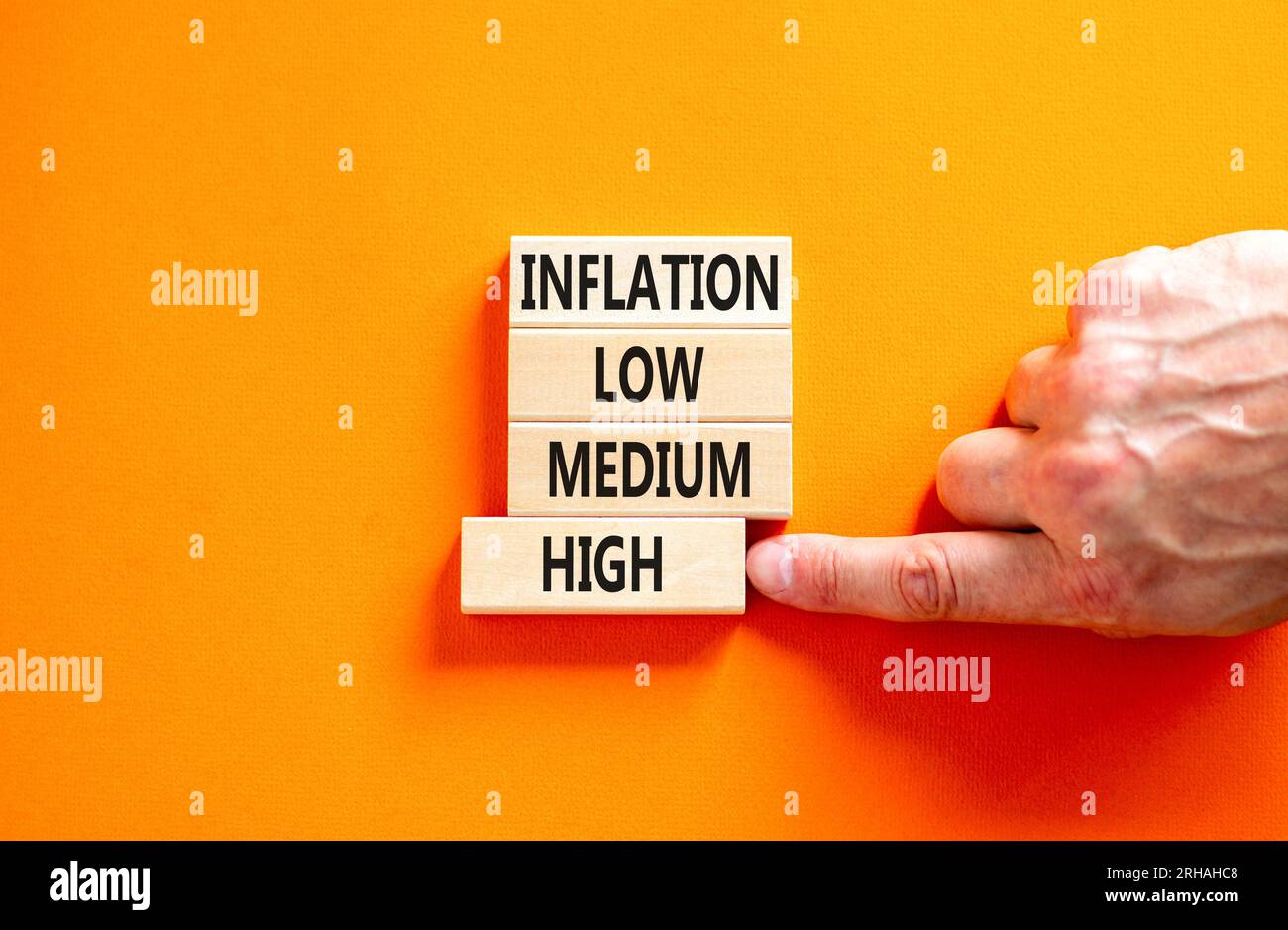 High inflation symbol. Concept word Inflation low medium high on wooden ...