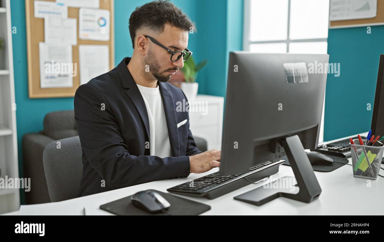 Young arab man business worker using computer at the office Stock Photo ...