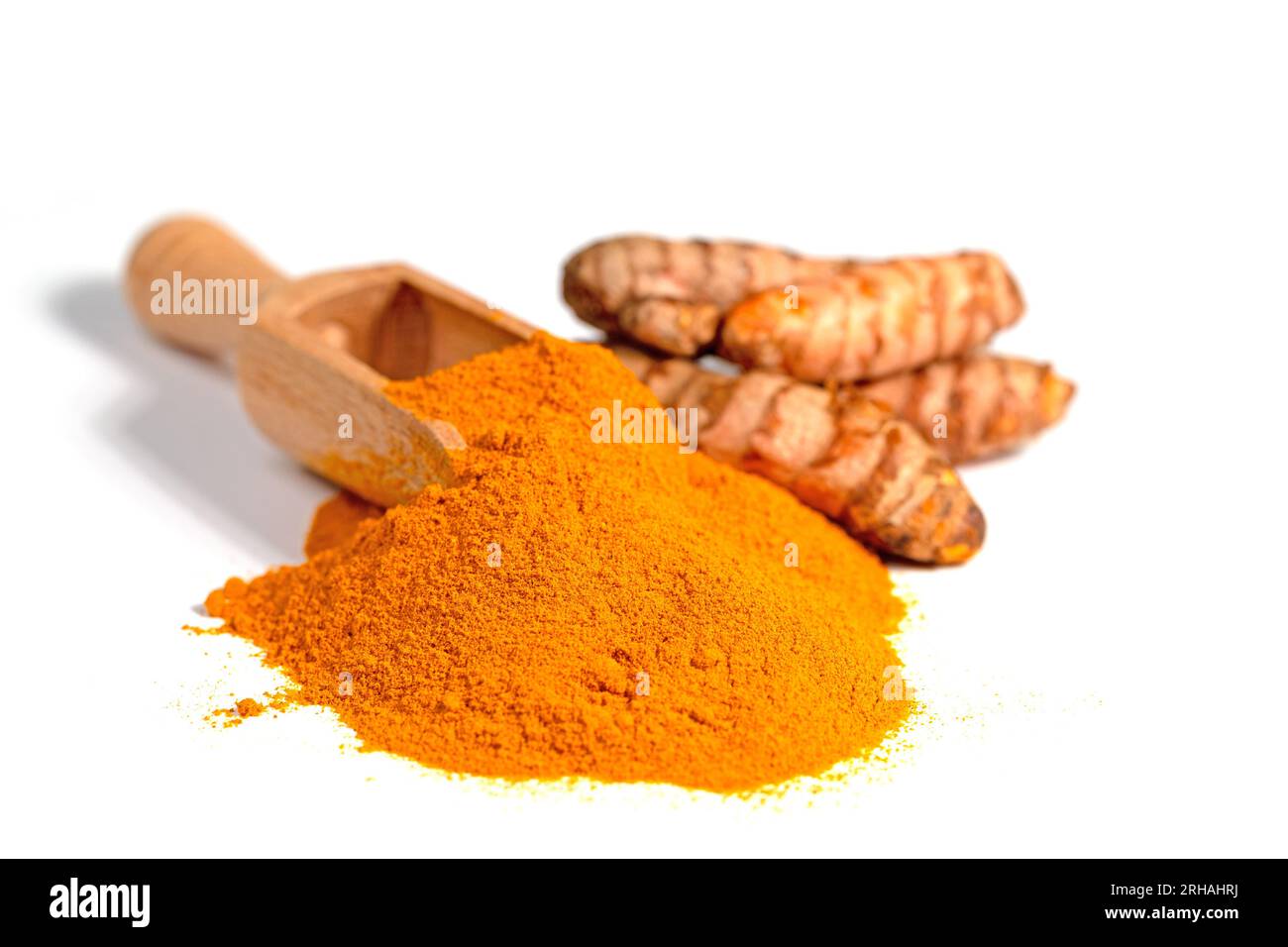 Ground turmeric root against white background Stock Photo - Alamy