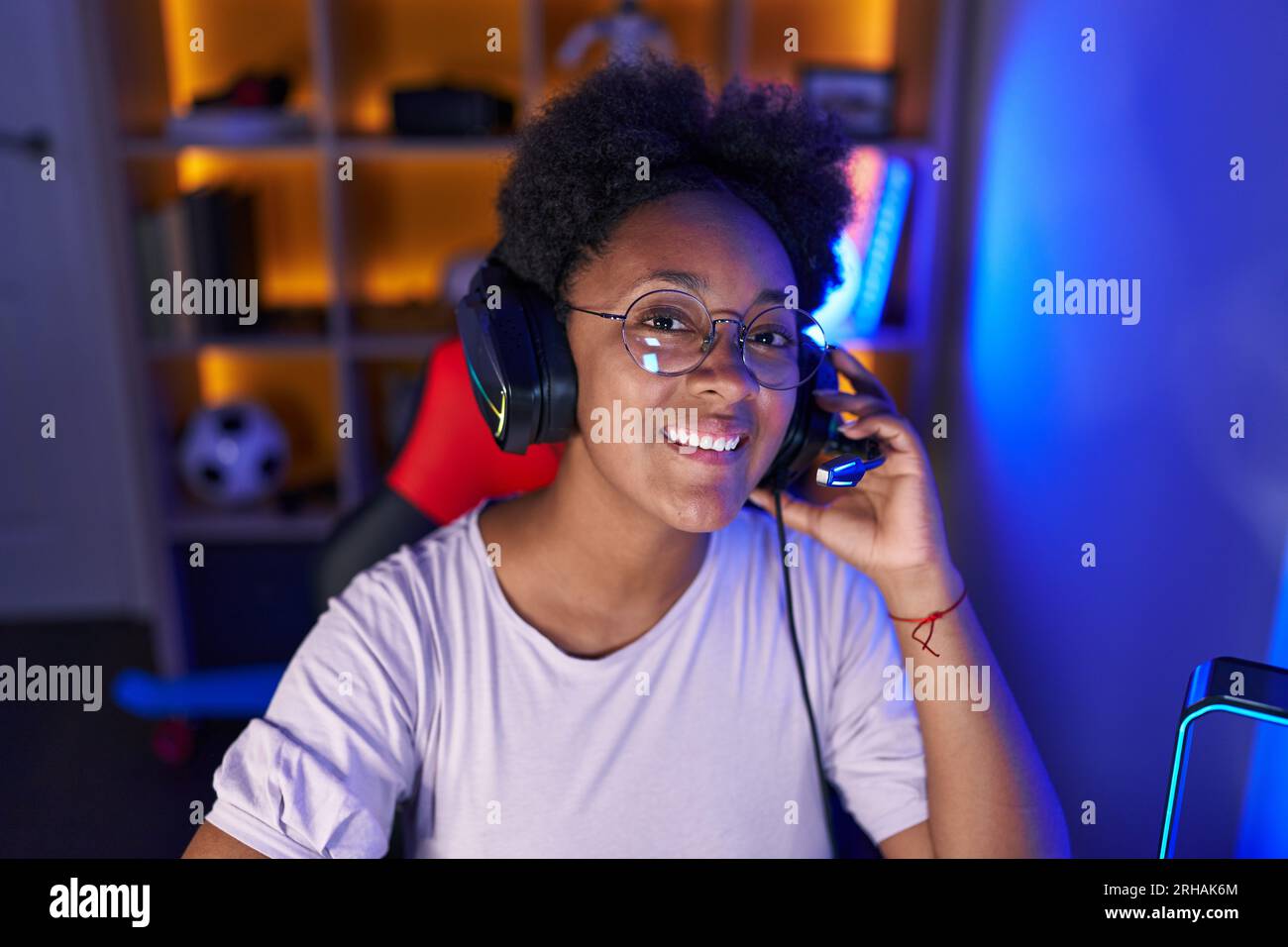 African american woman streamer smiling confident sitting on table at ...