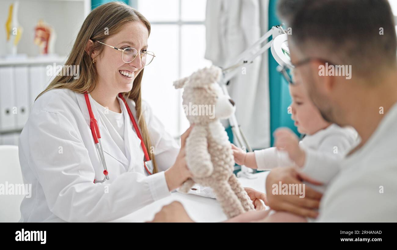 Hispanic father with baby on a doctor appointment at clinic Stock Photo ...