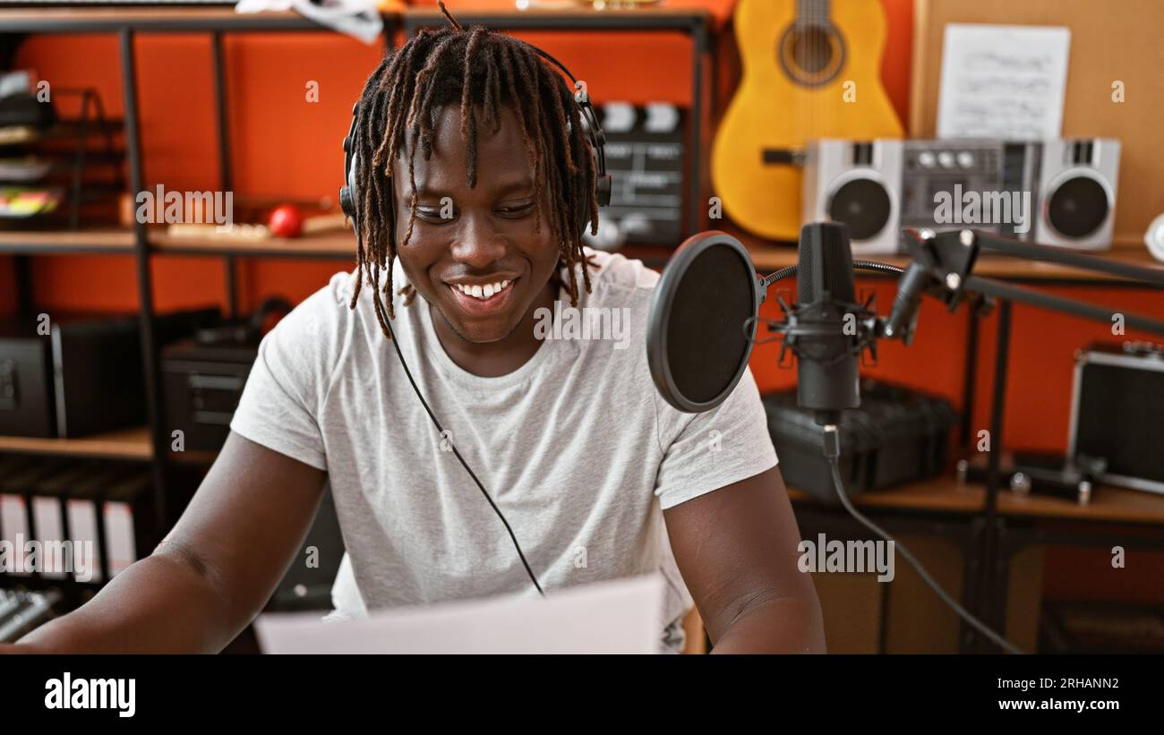 African american man musician smiling confident singing song at music ...