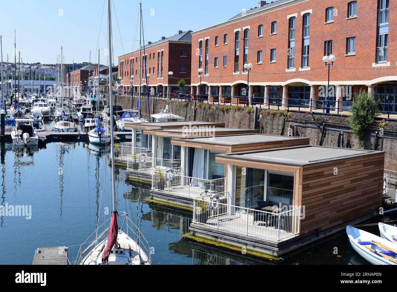 The impressive marina at Milford Haven has 300+ berths. Here a row of ...