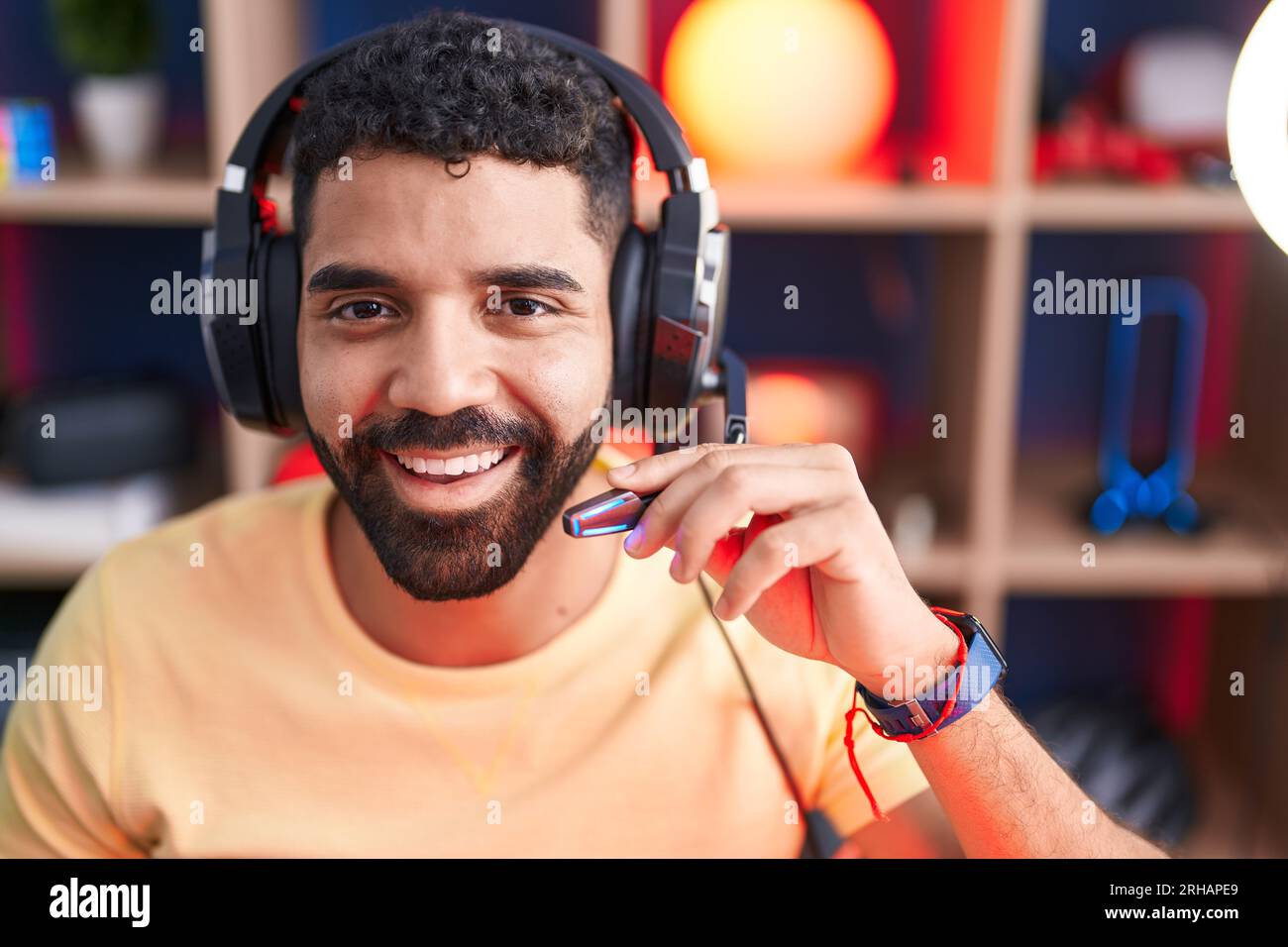 Young arab man streamer smiling confident speaking at gaming room Stock ...