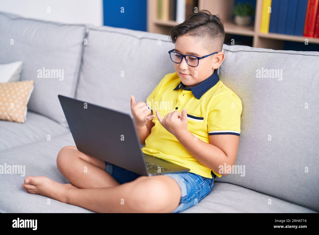 Adorable hispanic boy having video call communicate with sign deaf ...