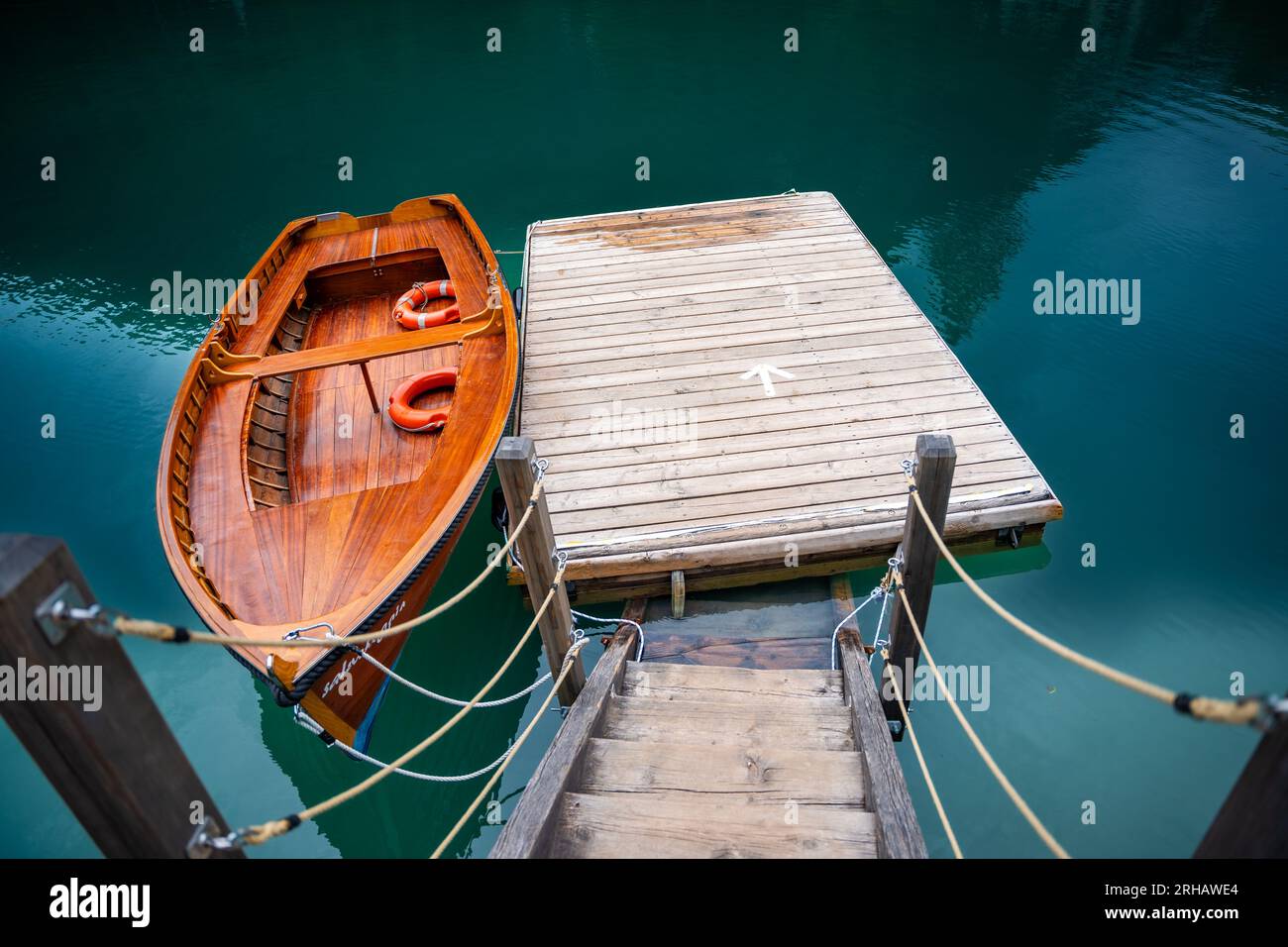 Traditional wooden rowing boat on scenic Lago di Braies in the ...