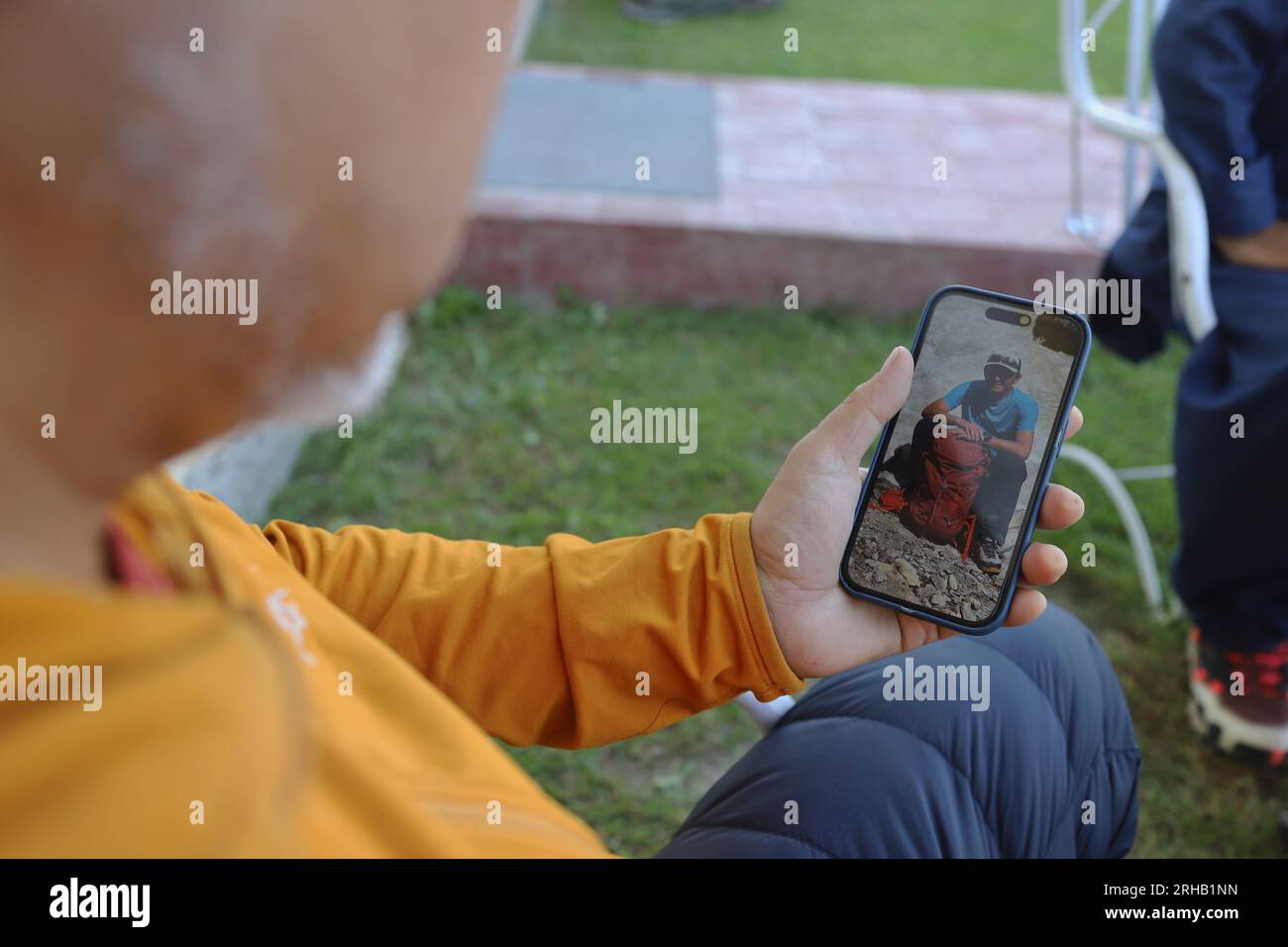 Japanese climber Semba Takayasu shows the picture of fellow climber ...
