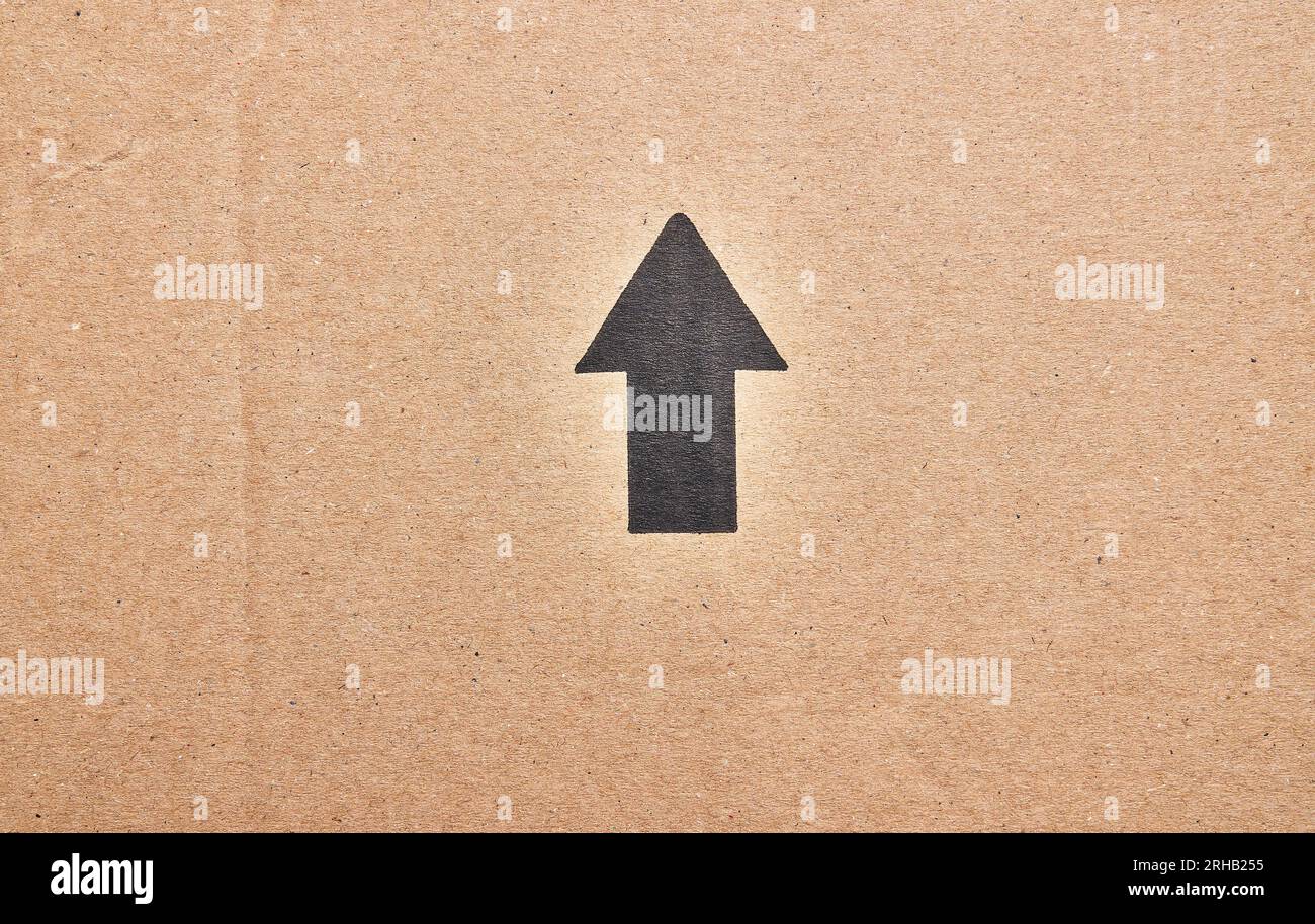 Brown cardboard carton material with arrow texture background Stock ...