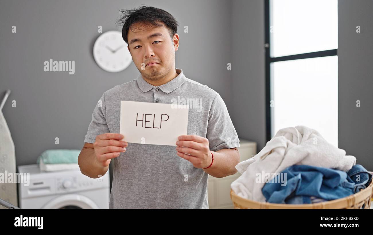 asking for help standing by clothesline at laundry room Stock Photo - Alamy