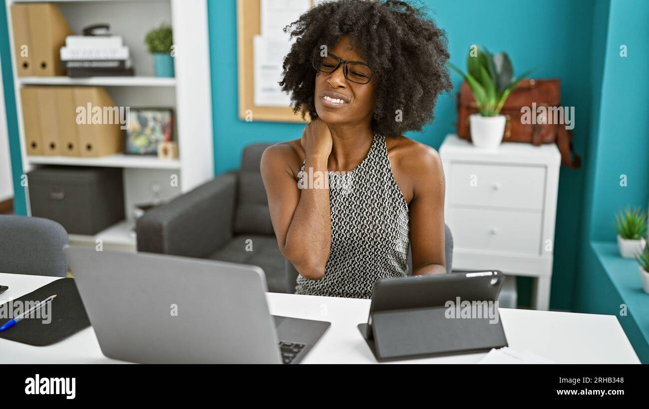 African american woman business worker using touchpad and laptop ...
