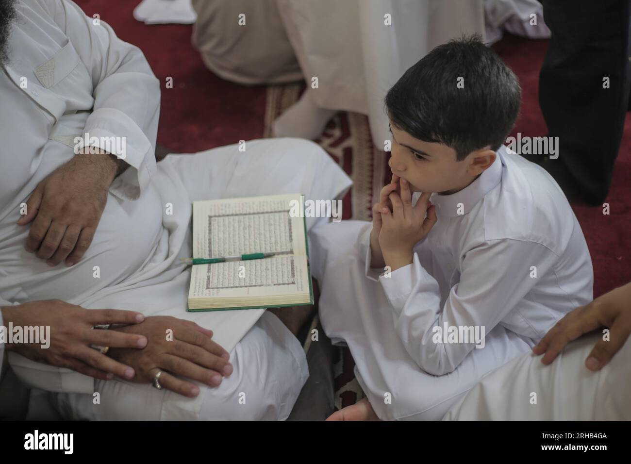 Palestinians Muslim devotees read the holy Quran during one session, at ...