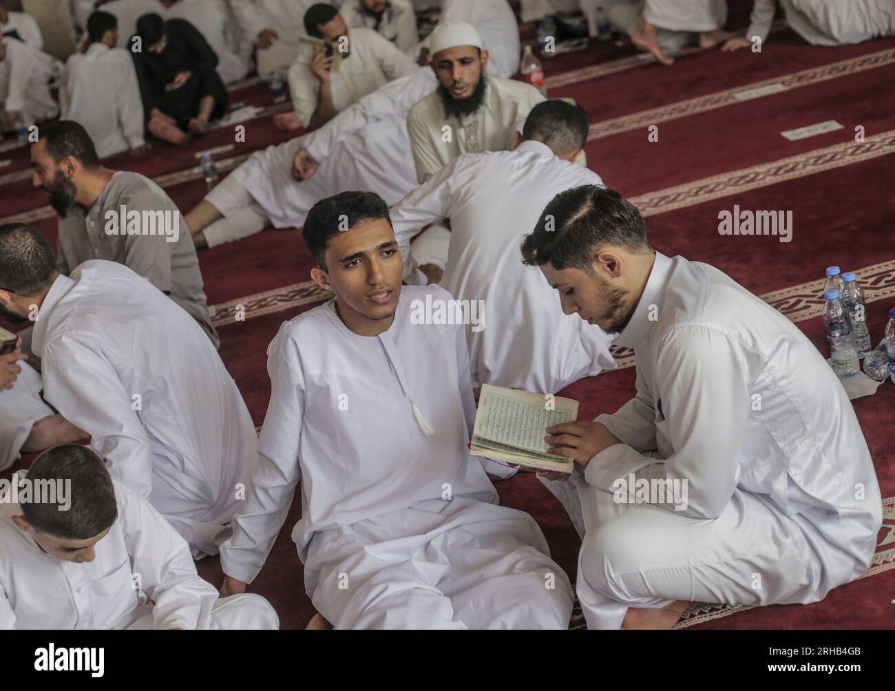 Palestinians Muslim devotees read the holy Quran during one session, at ...