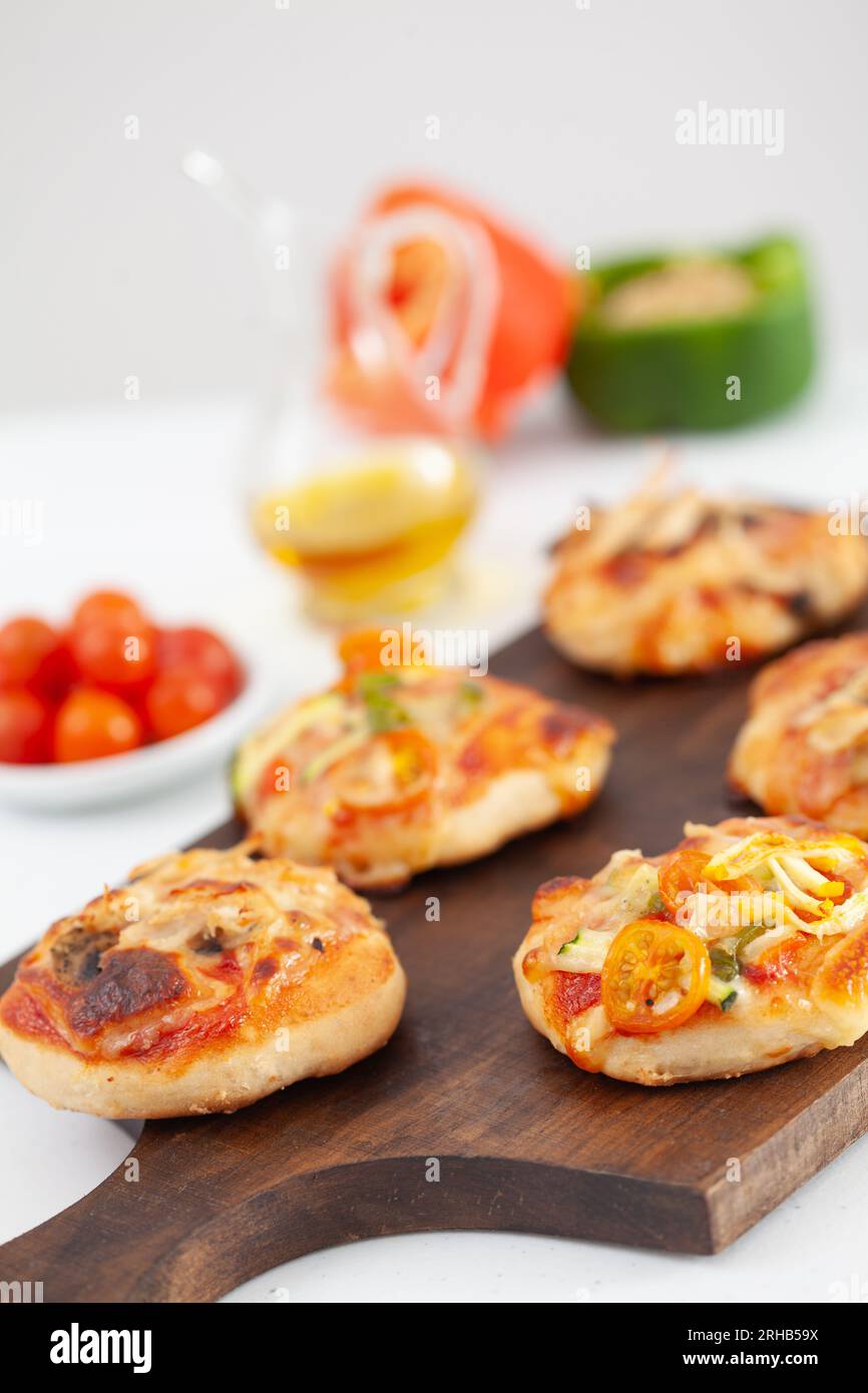 Delicious just baked homemade mini pizzas Stock Photo - Alamy