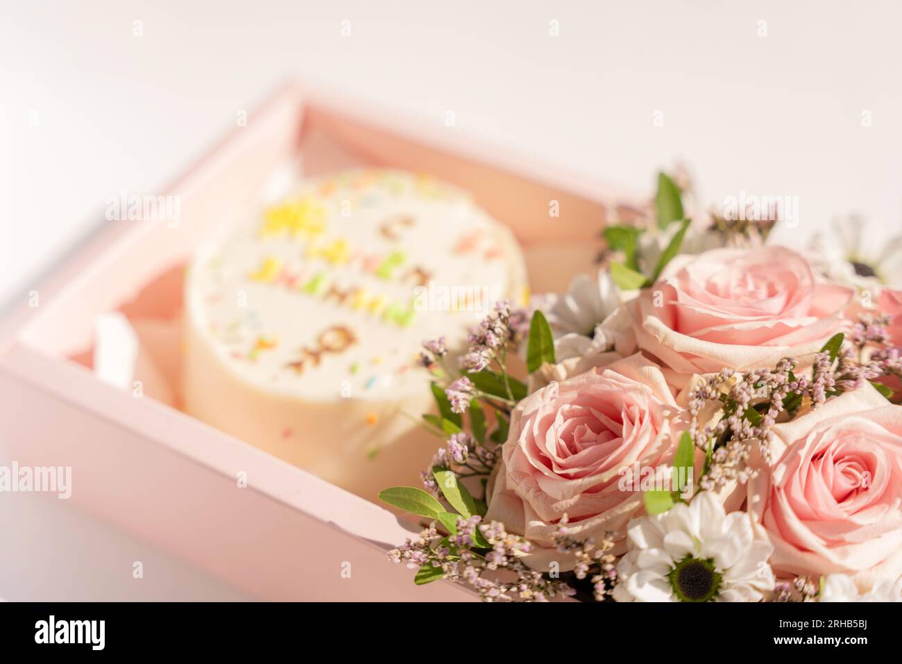 Cake with blooming roses in pink gift box on white background Stock ...