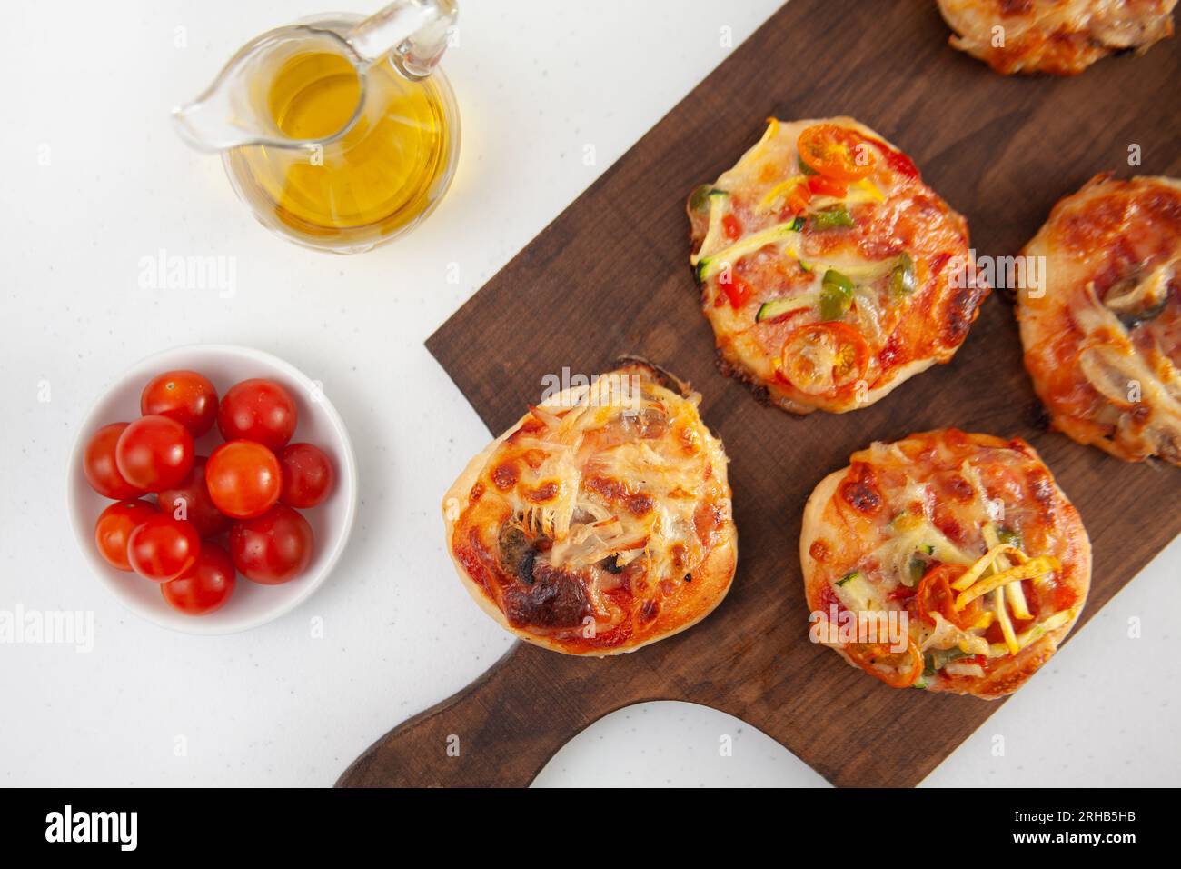Delicious just baked homemade mini pizzas Stock Photo - Alamy