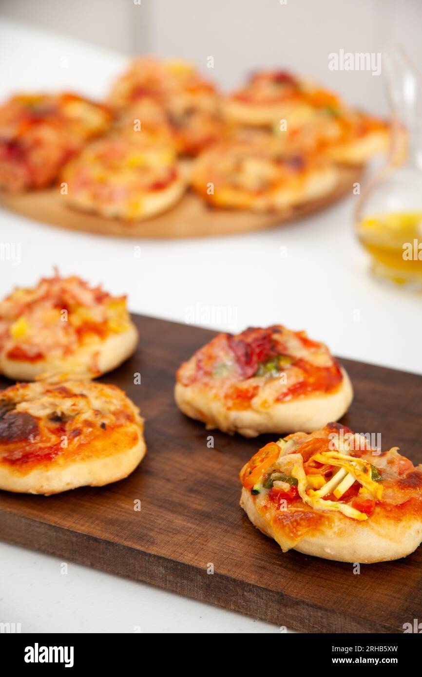 Delicious just baked homemade mini pizzas. Vegetarian pizza Stock Photo - Alamy