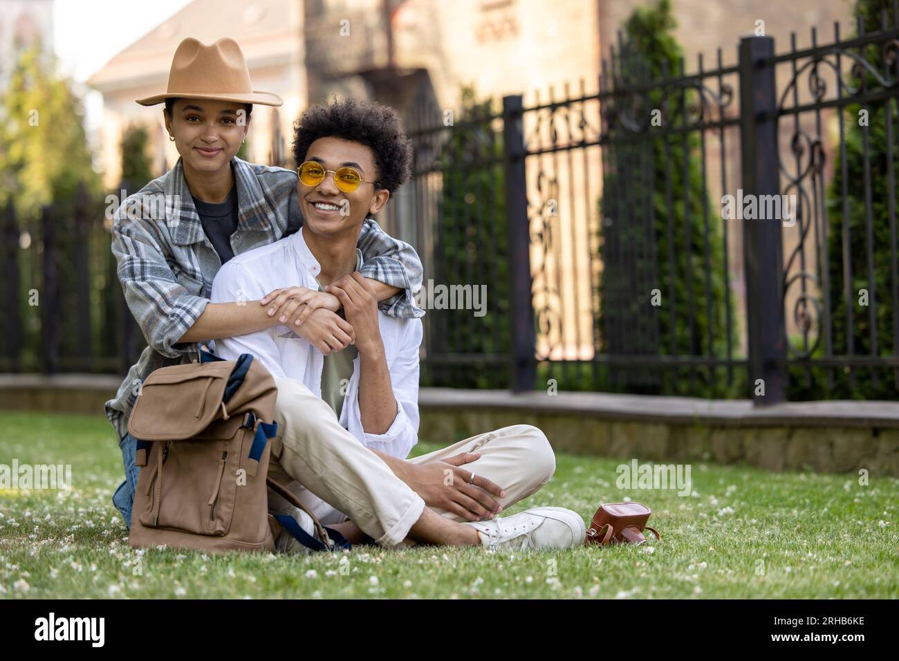 Cute girl hugging her boyfriend and both looking happy Stock Photo - Alamy