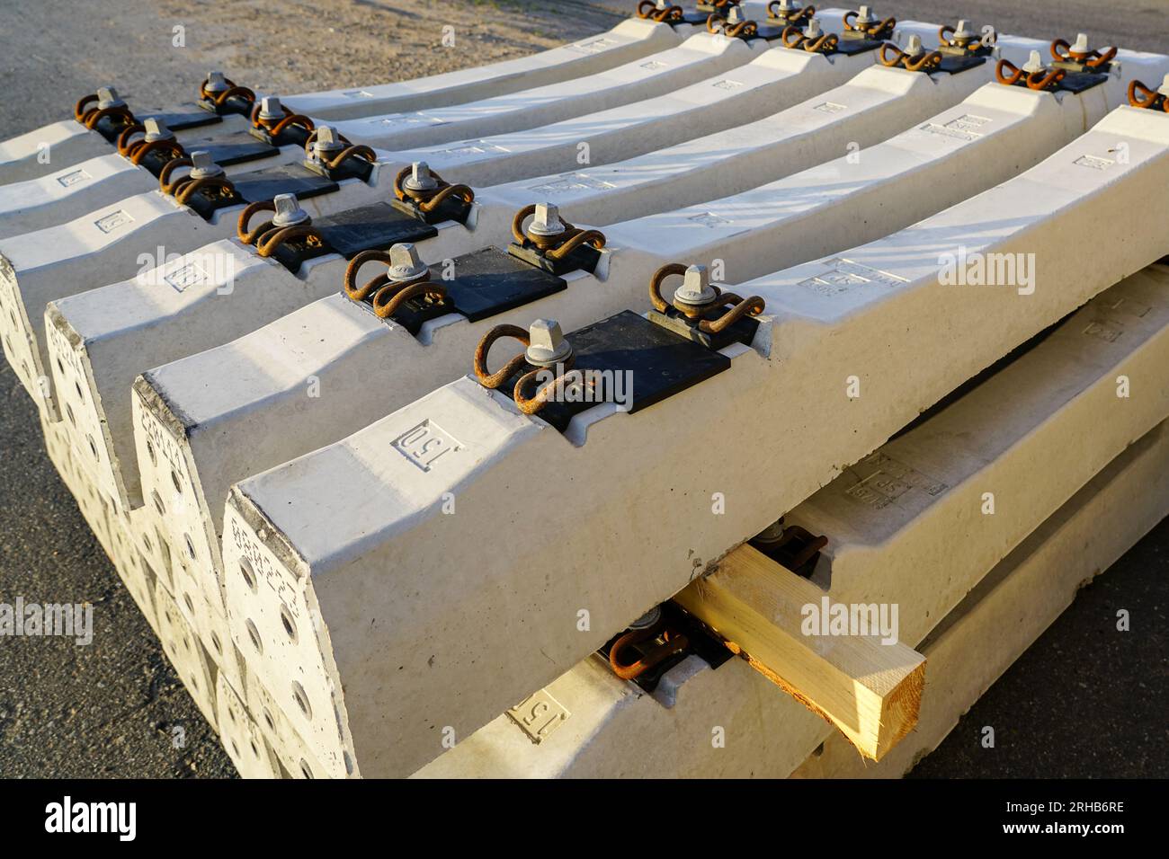 Before installation stacked new reinforced concrete railroad track ...