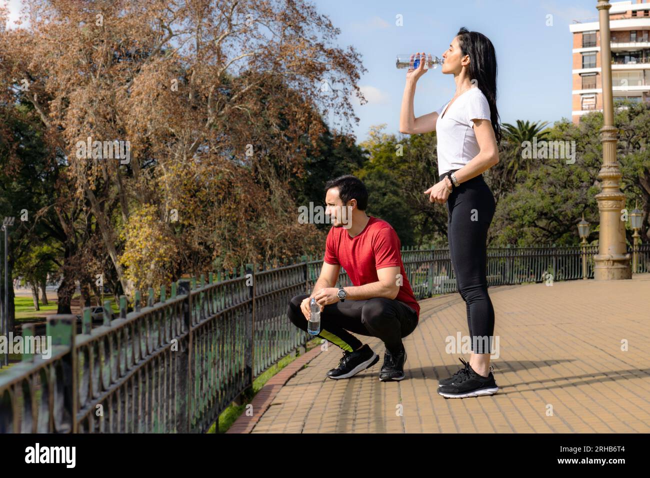 Fit people resting taking a break after workout - Healthy lifestyle ...