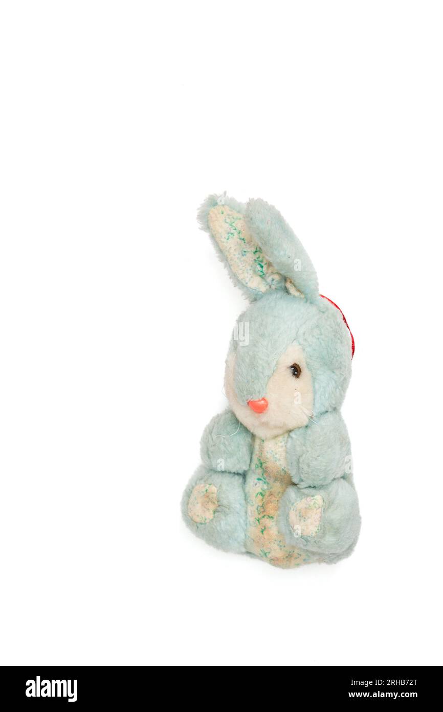 Well-loved stuffed rabbit toy from the 1980s, on a white background ...