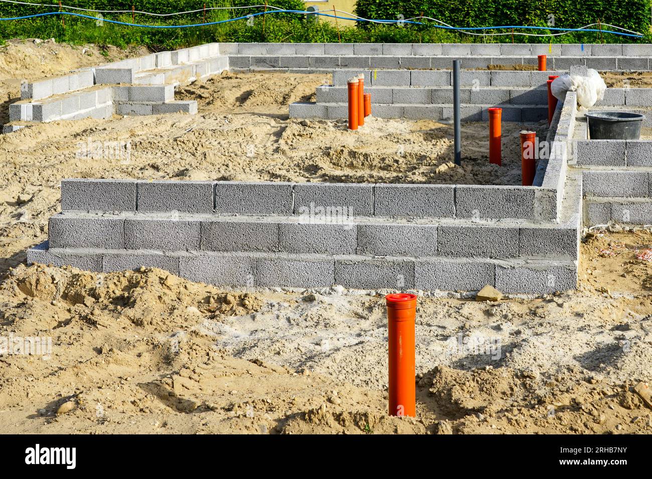 Building the foundation of the house from concrete blocks and ...