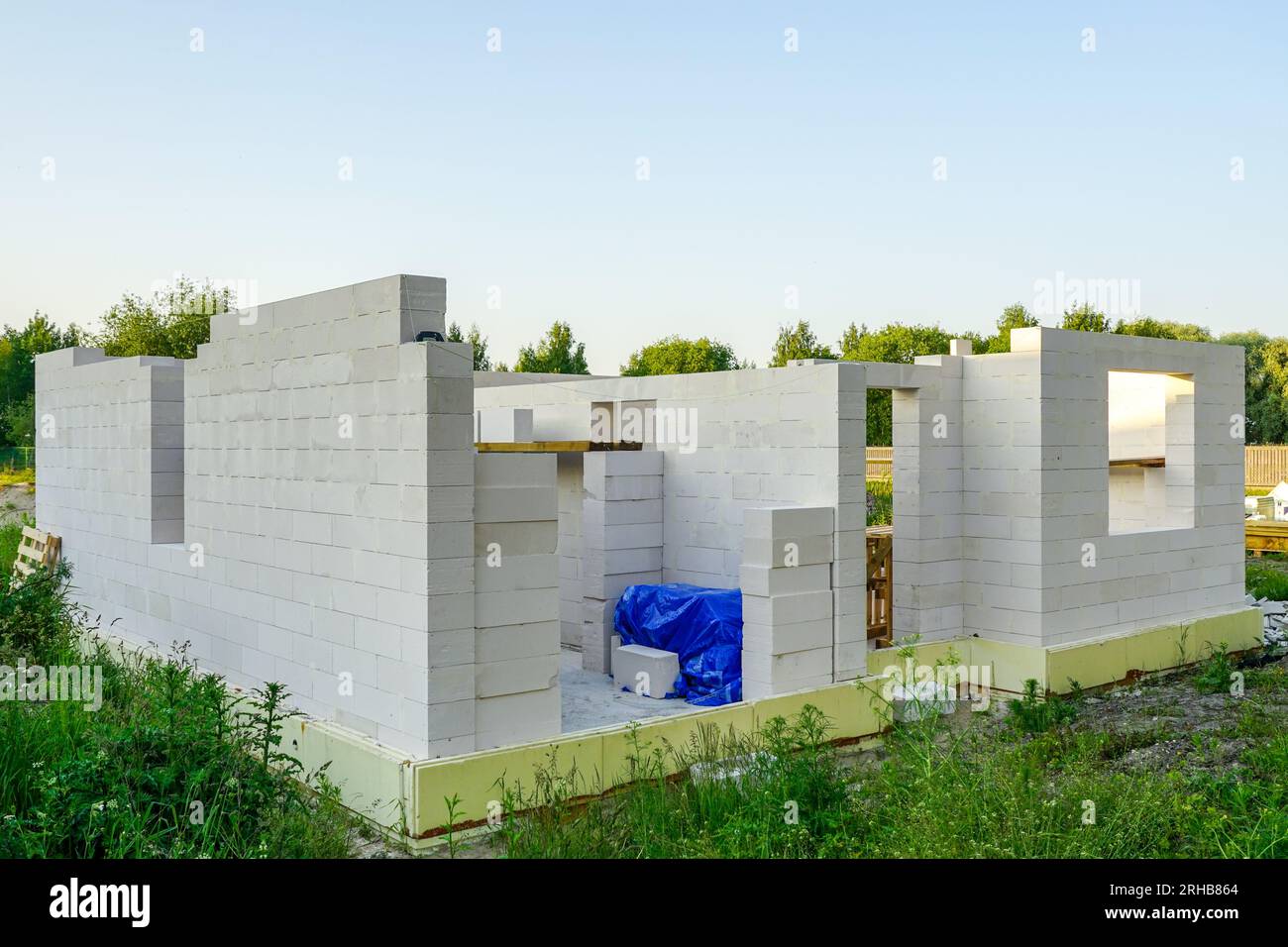Single family house construction site, wall construction from concrete ...
