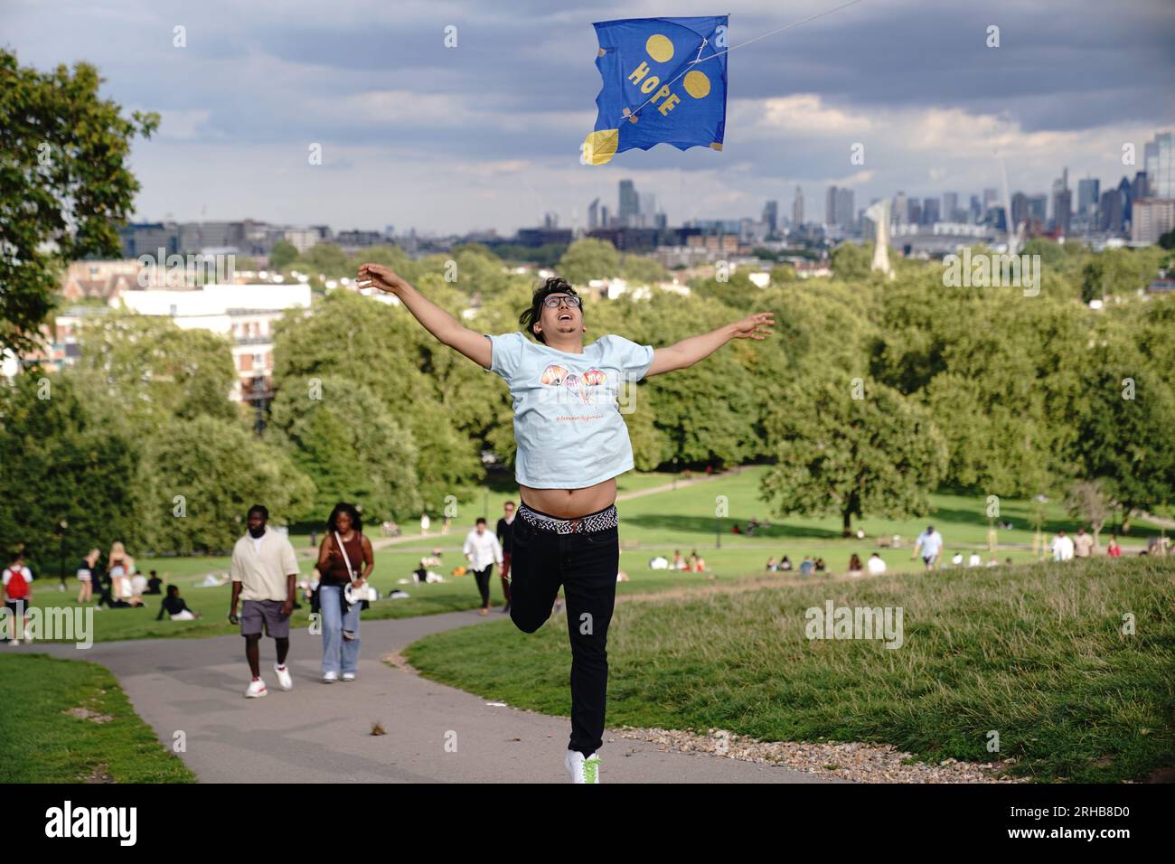 People taking part in an Afghan kite-flying event at a park in London ...
