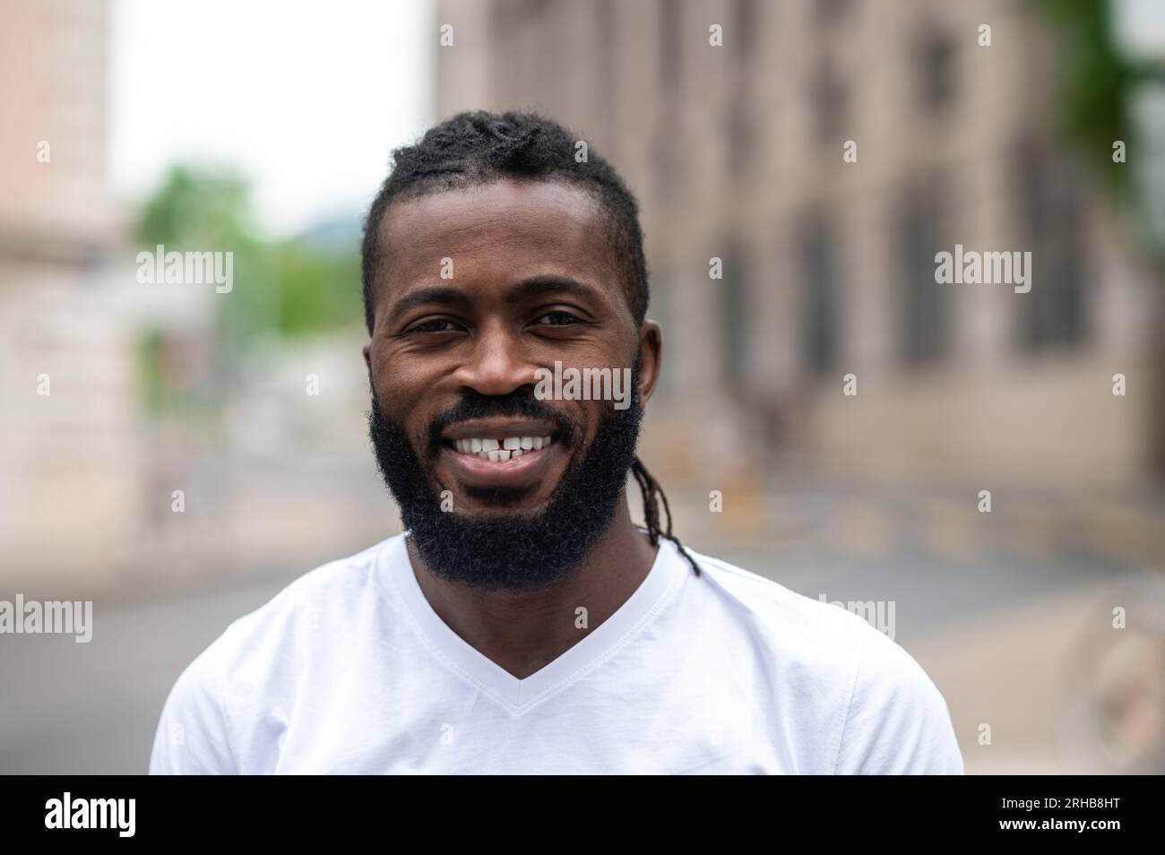 Portrait picture of a smiling dark-skinned handsome man Stock Photo - Alamy
