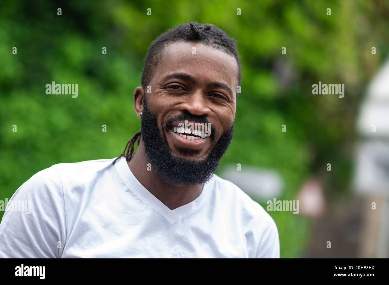 Portrait picture of a smiling dark-skinned handsome man Stock Photo - Alamy