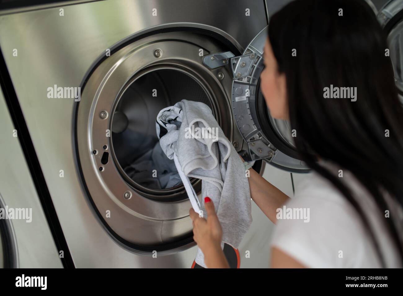 Woman sorting laundry washing machine hi-res stock photography and images - Alamy