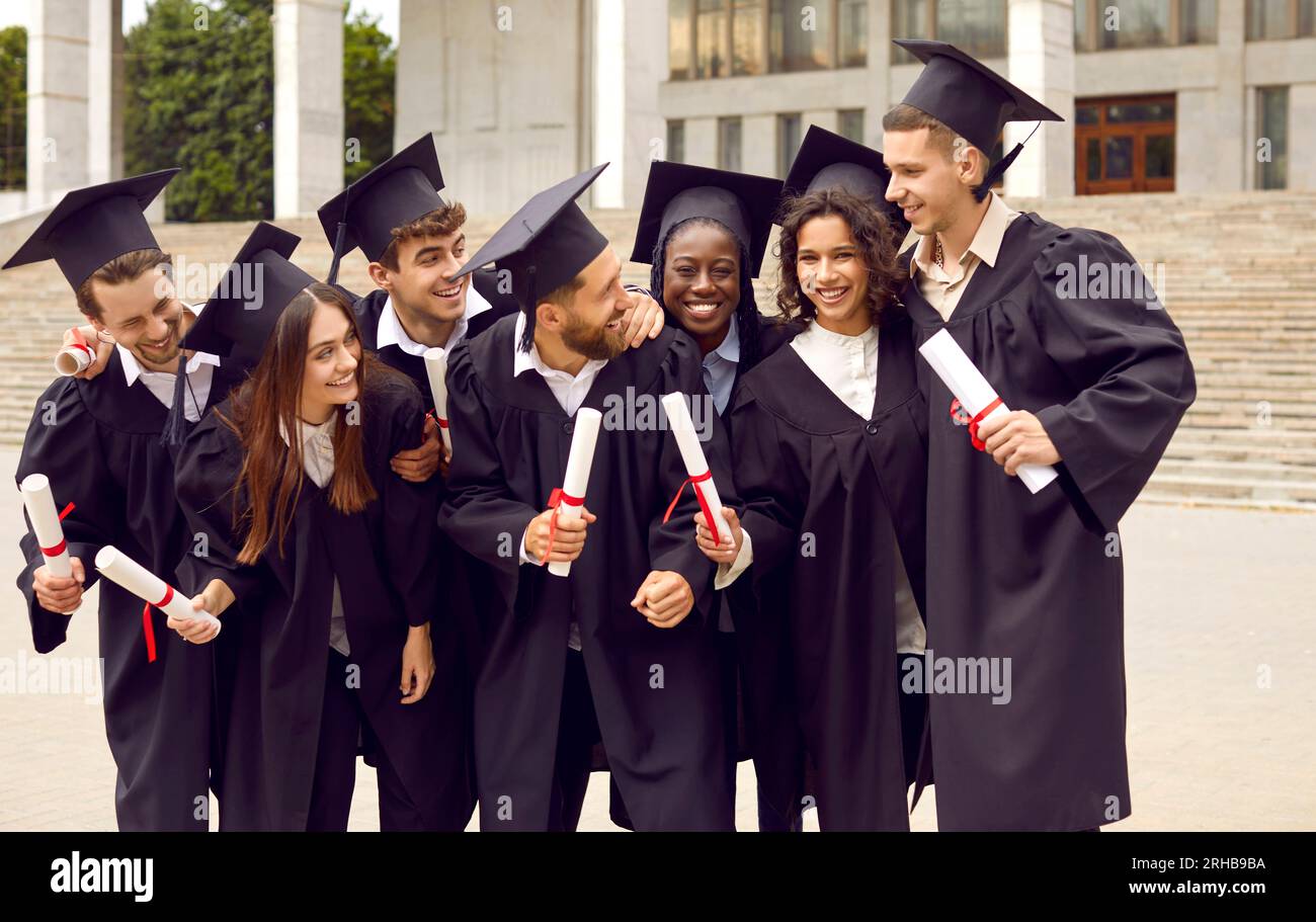 Group of happy successful multiracial students celebrating university ...