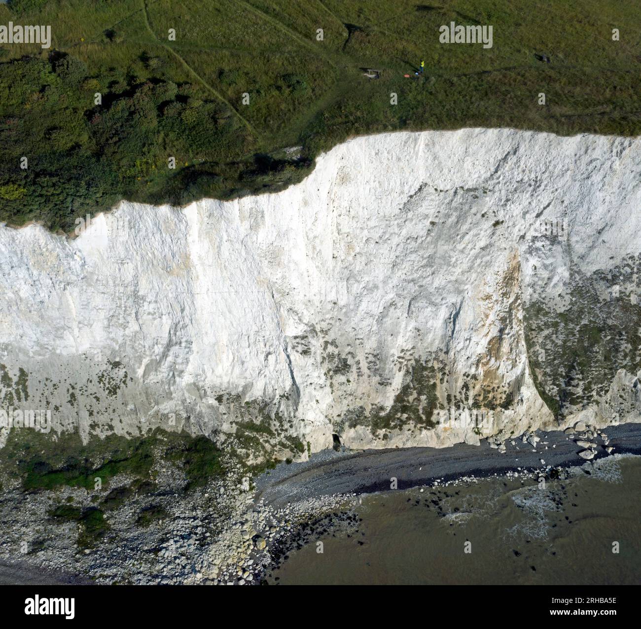 Aerial taken by a drone, flying out over the sea, looking towards of a ...